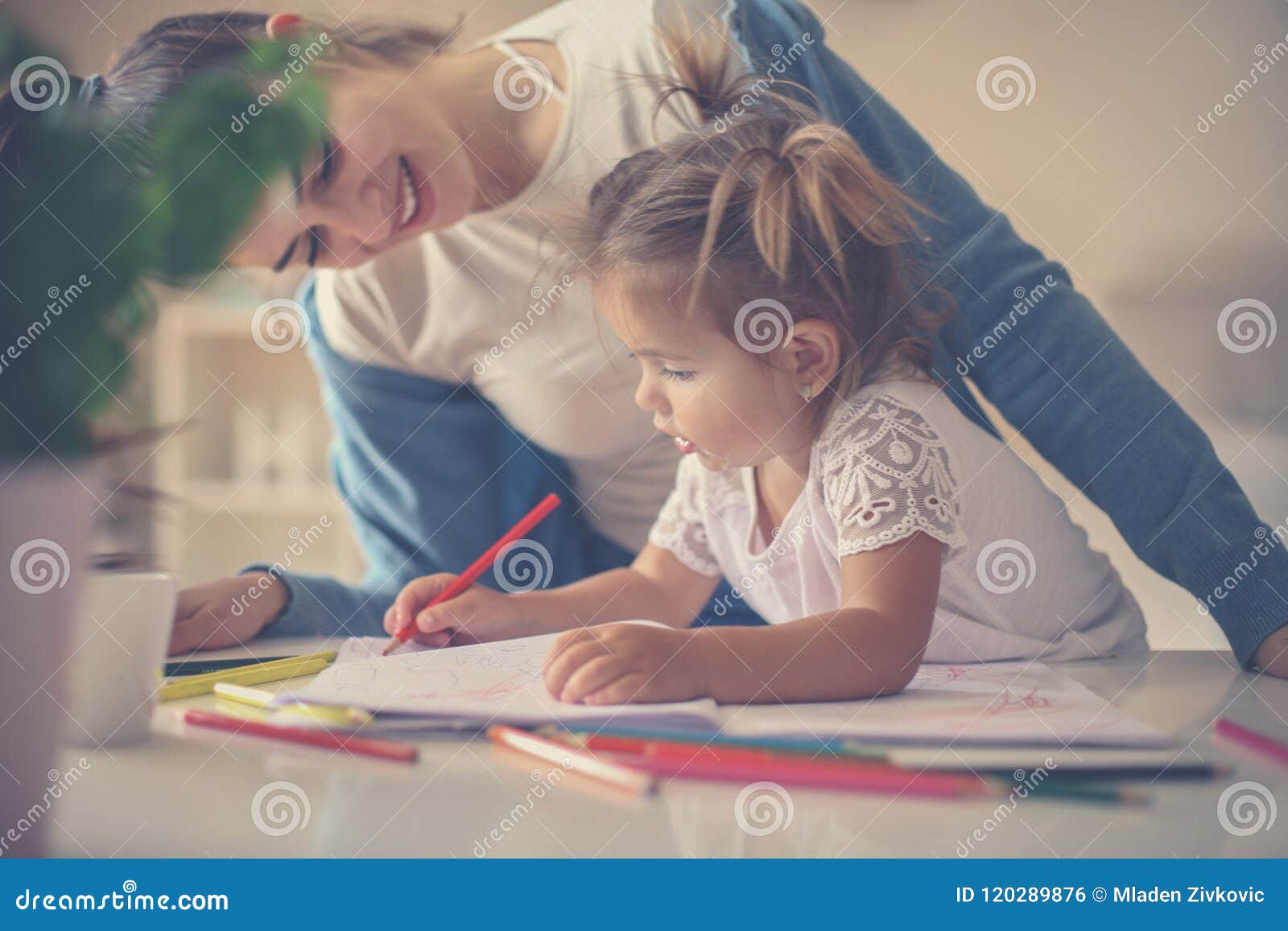 Mother Teaching Her Daughter To Drawing and Writing at H Stock Photo ... Mother Teaching Her Daughter To Drawing and Writing at H Stock Photo ...