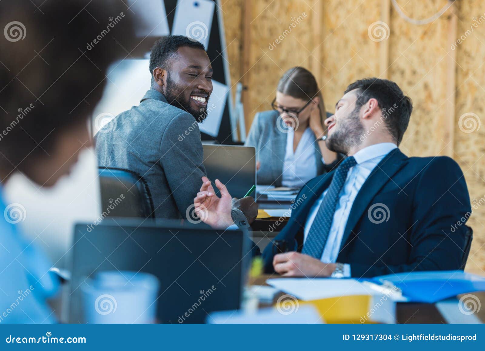 Smiling Multicultural Businessmen Talking Stock Photo - Image of ...