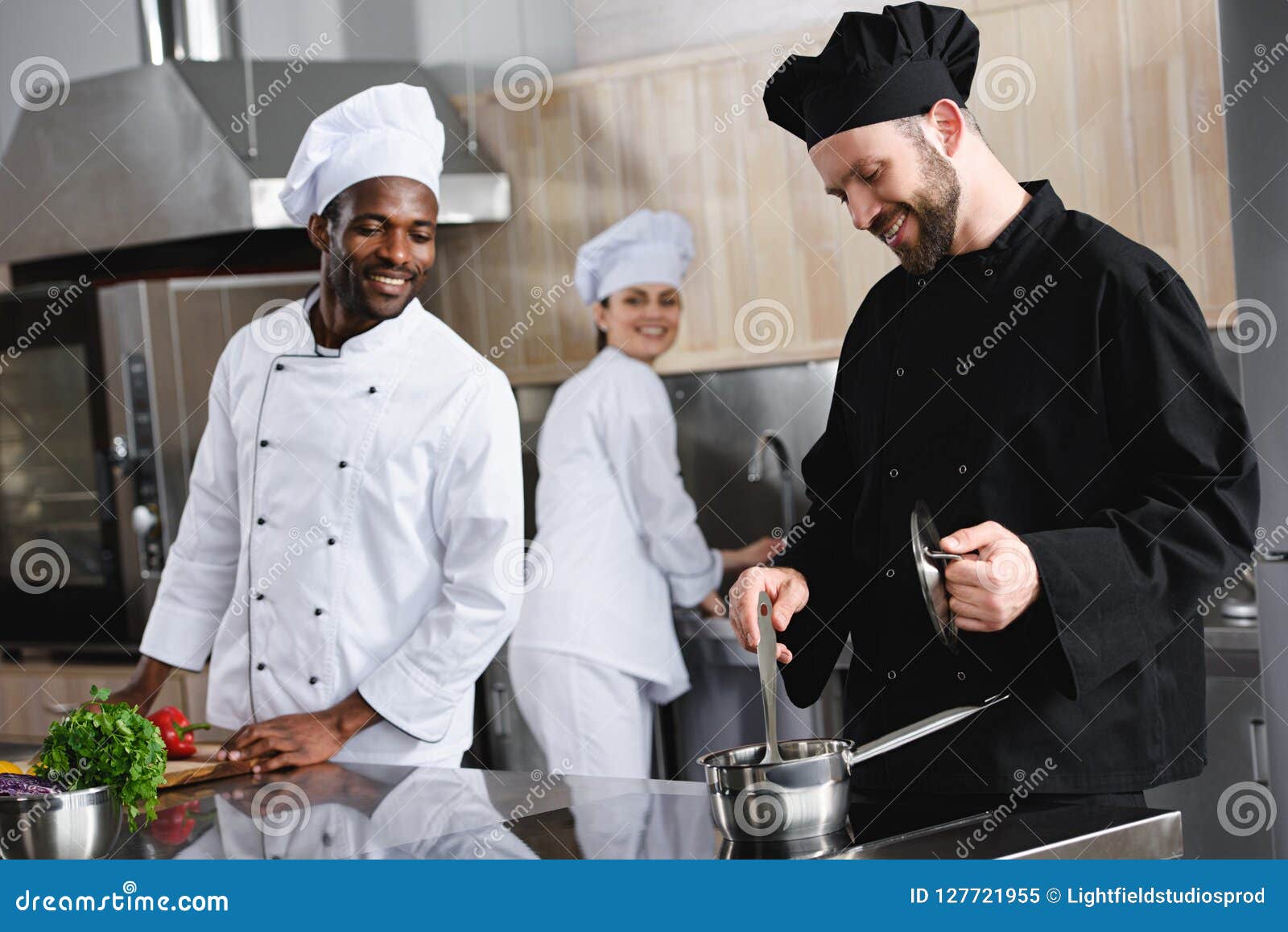 Smiling Multicultural Chefs Cooking Together Stock Image - Image of ...