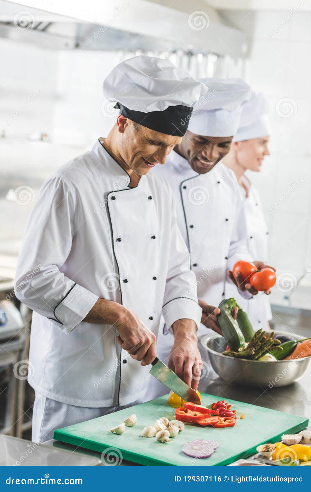 Smiling Multicultural Chefs Preparing Food Stock Photo - Image of ...