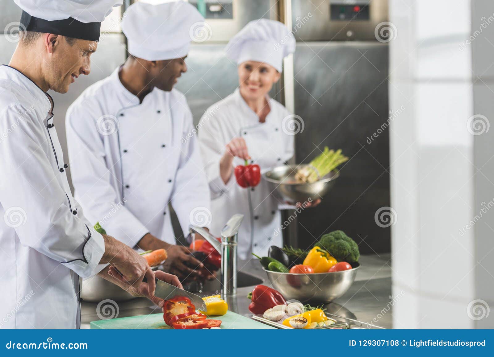 Smiling Multicultural Chefs Preparing Food Stock Photo - Image of ...