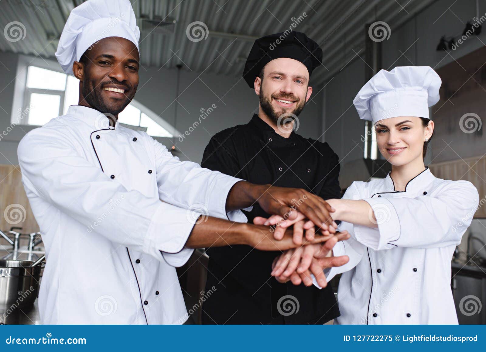 Smiling Multicultural Chefs Putting Hands Together Stock Image - Image ...