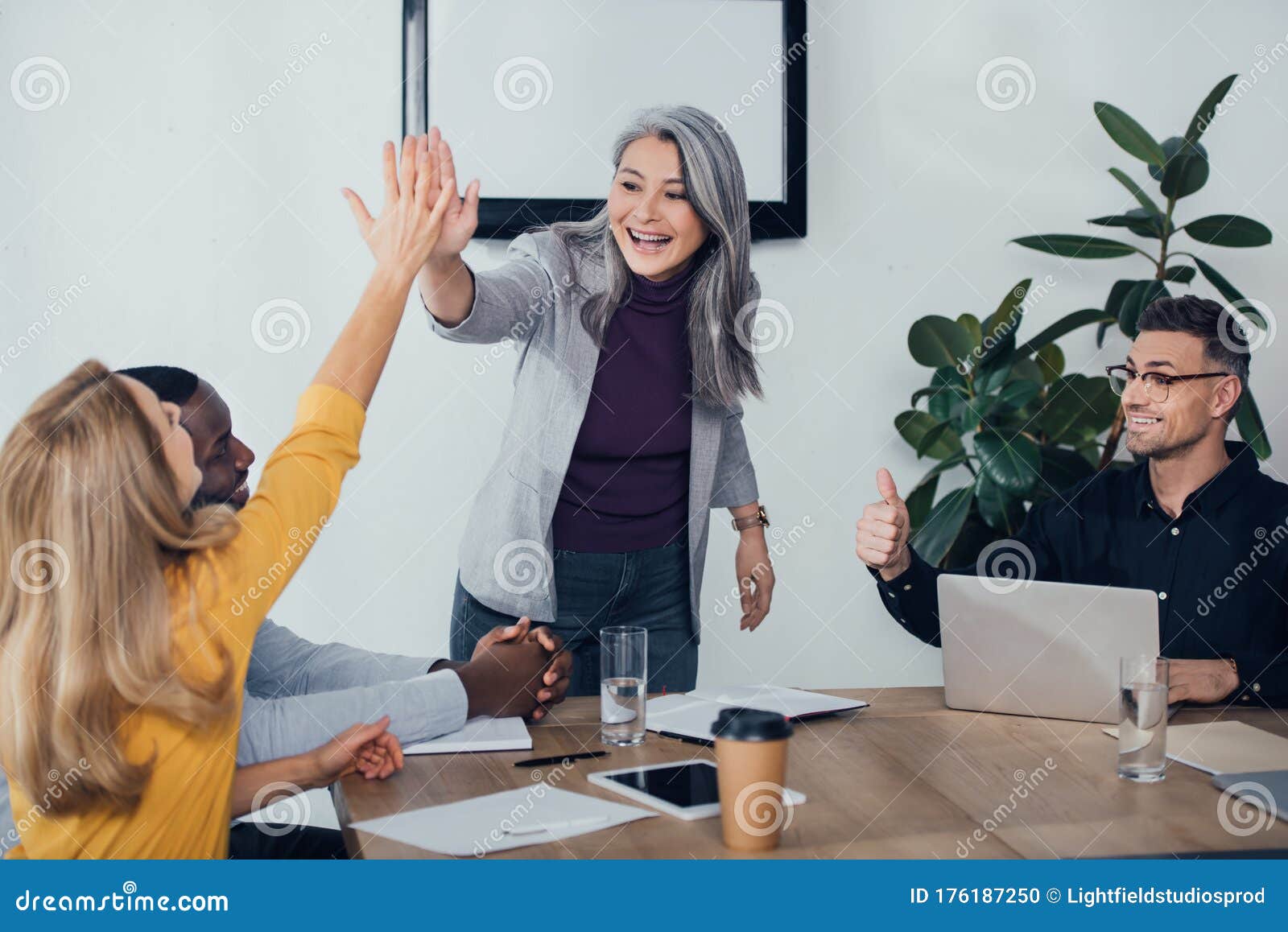Multicultural Colleagues Giving High Five and Stock Photo - Image of ...