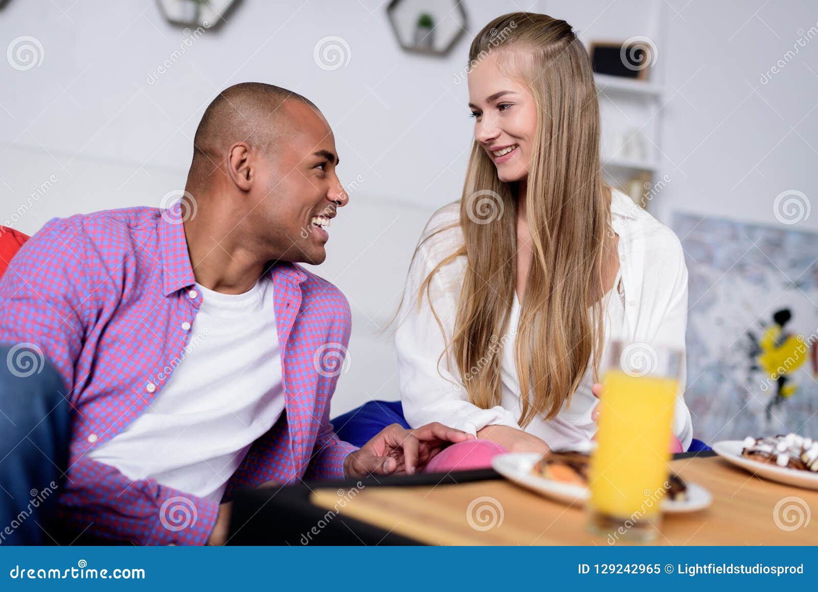 Smiling Multicultural Couple Looking Stock Image - Image of ...