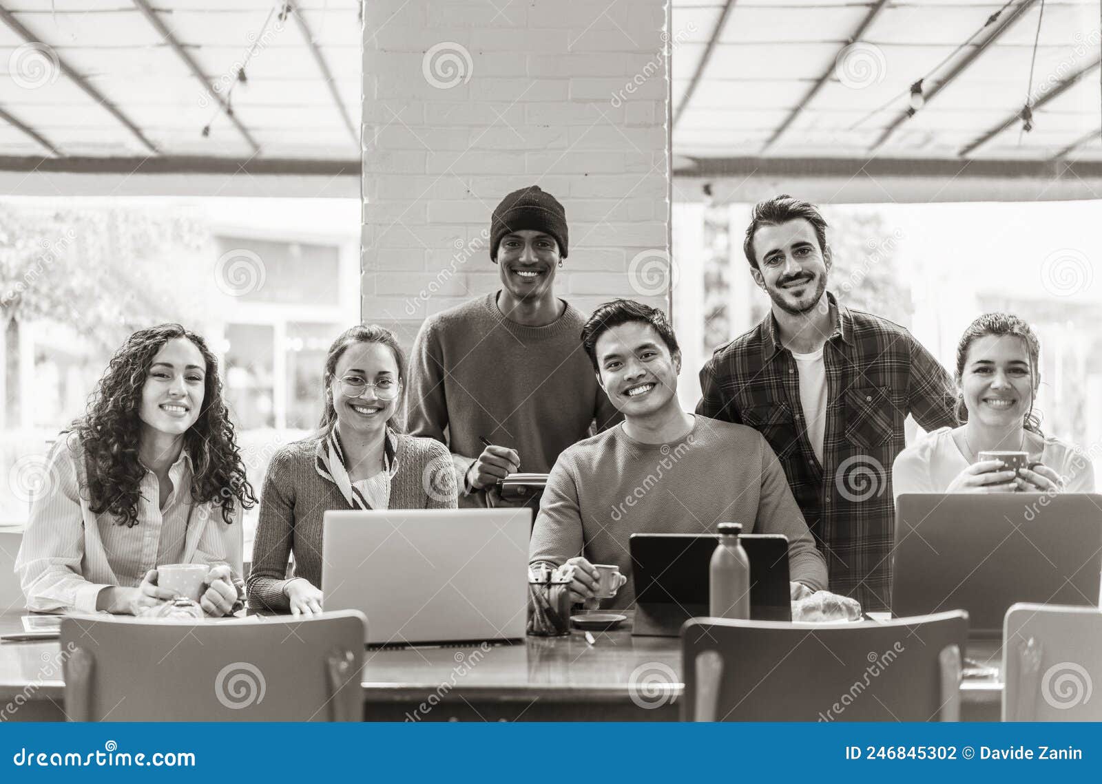 Smiling Multiethnic Coworkers Looking At Camera Making Team Picture In