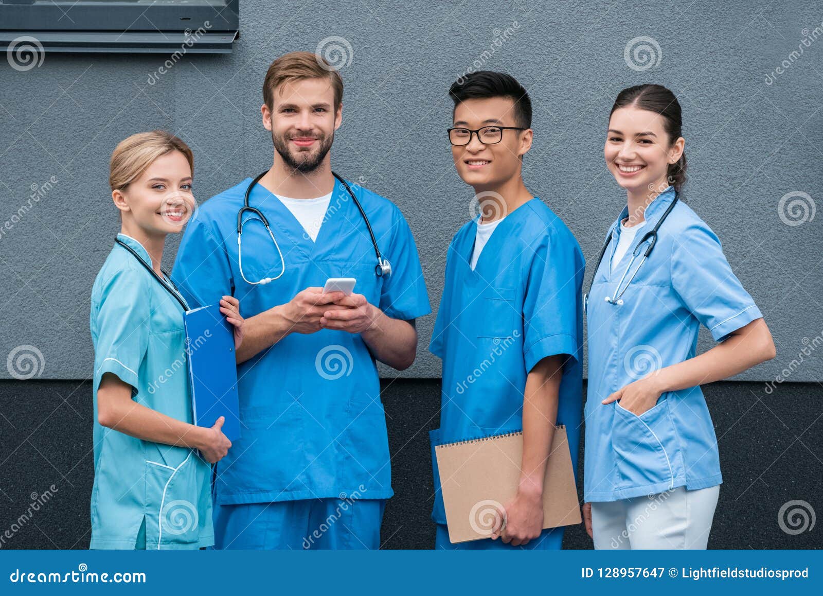 Smiling Multiethnic Medical Students Looking at Camera Near Medical ...