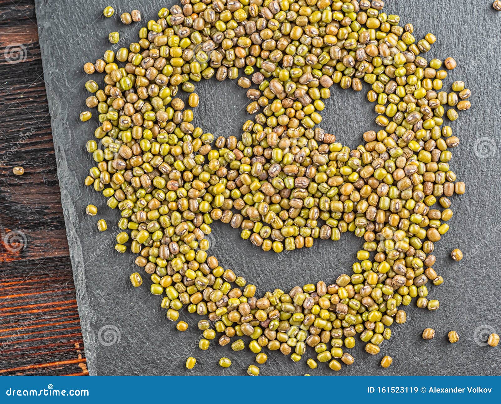 A Smiling Muzzle Made From Mung Bean Beans Is On The Surface Of The ...