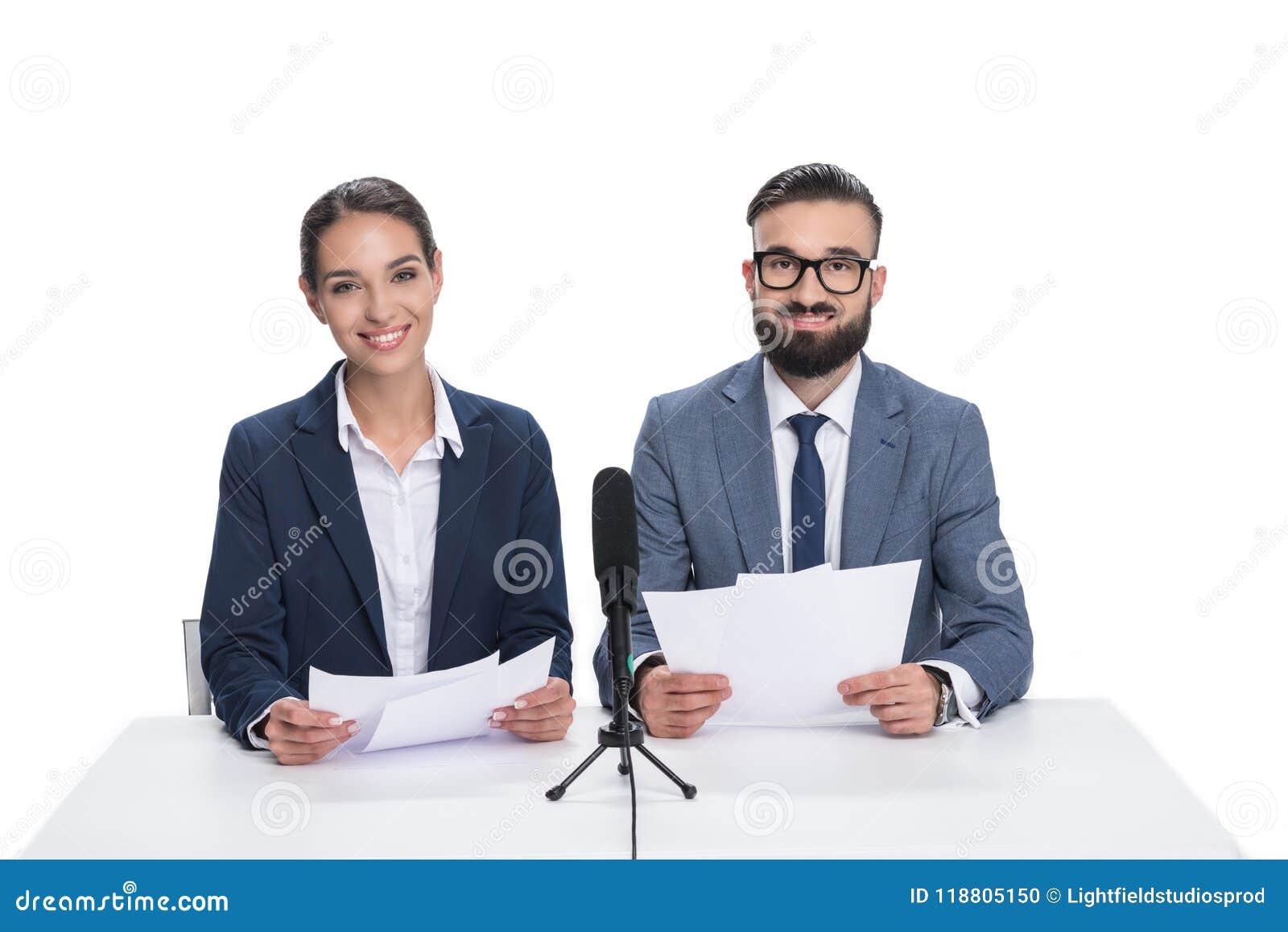 Smiling Newscasters with Papers and Microphone Looking at Camera, Stock ...