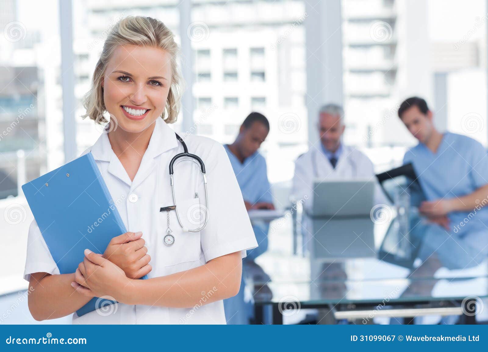Smiling nurse holding file stock image. Image of coat - 31099067