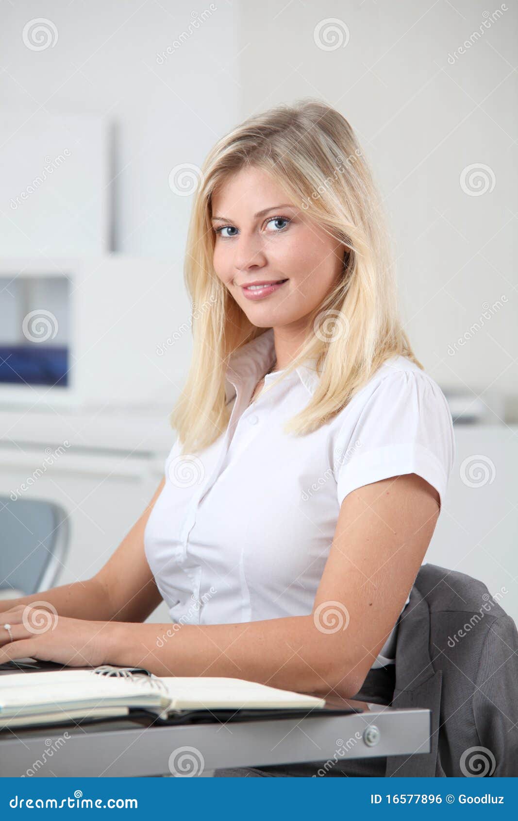 Smiling office worker stock photo. Image of secretary - 16577896
