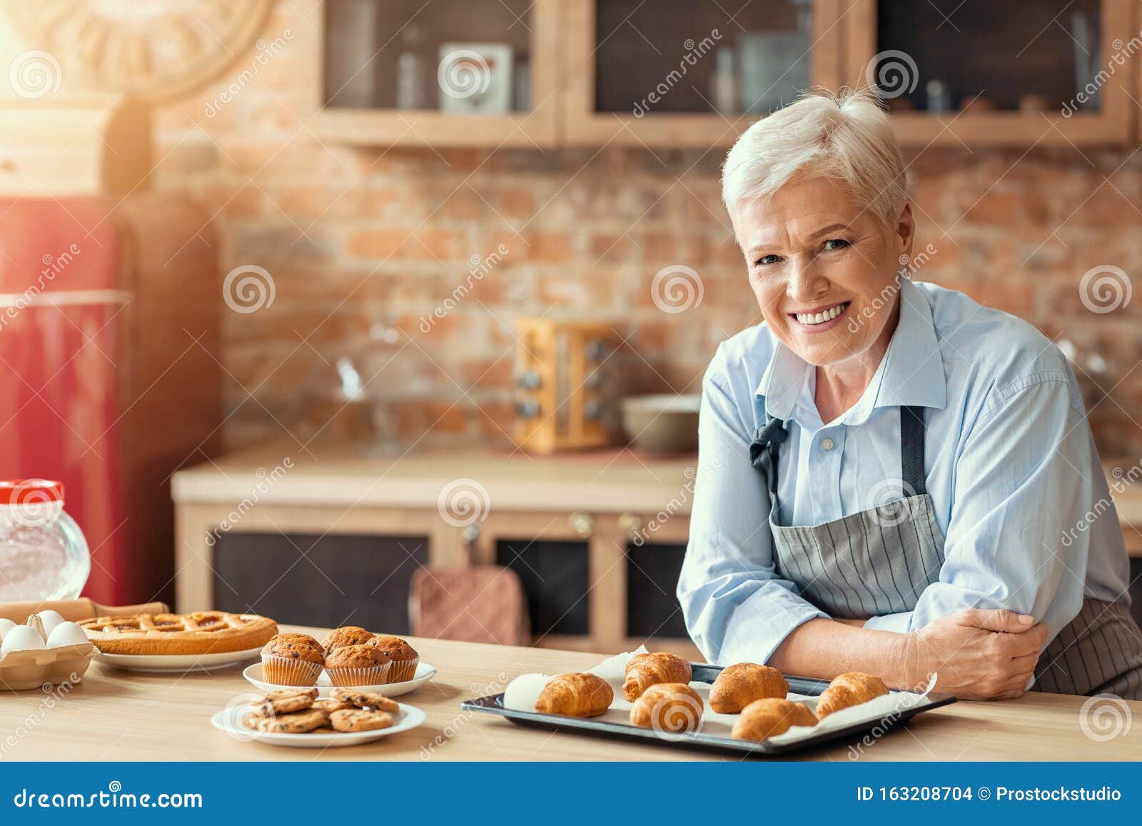 Smiling Old Lady Posing with Freshly Baked Pastry in Kitchen Stock ...