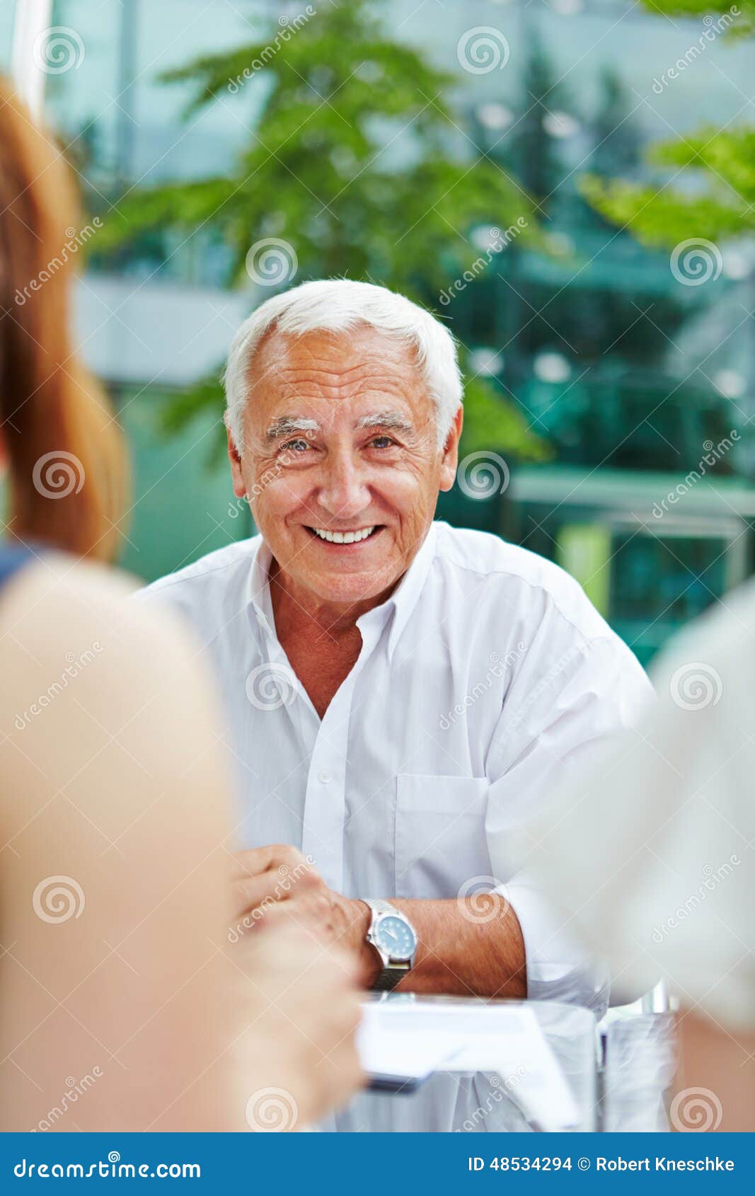 Smiling Old Manager Sitting on Table Stock Photo - Image of ...