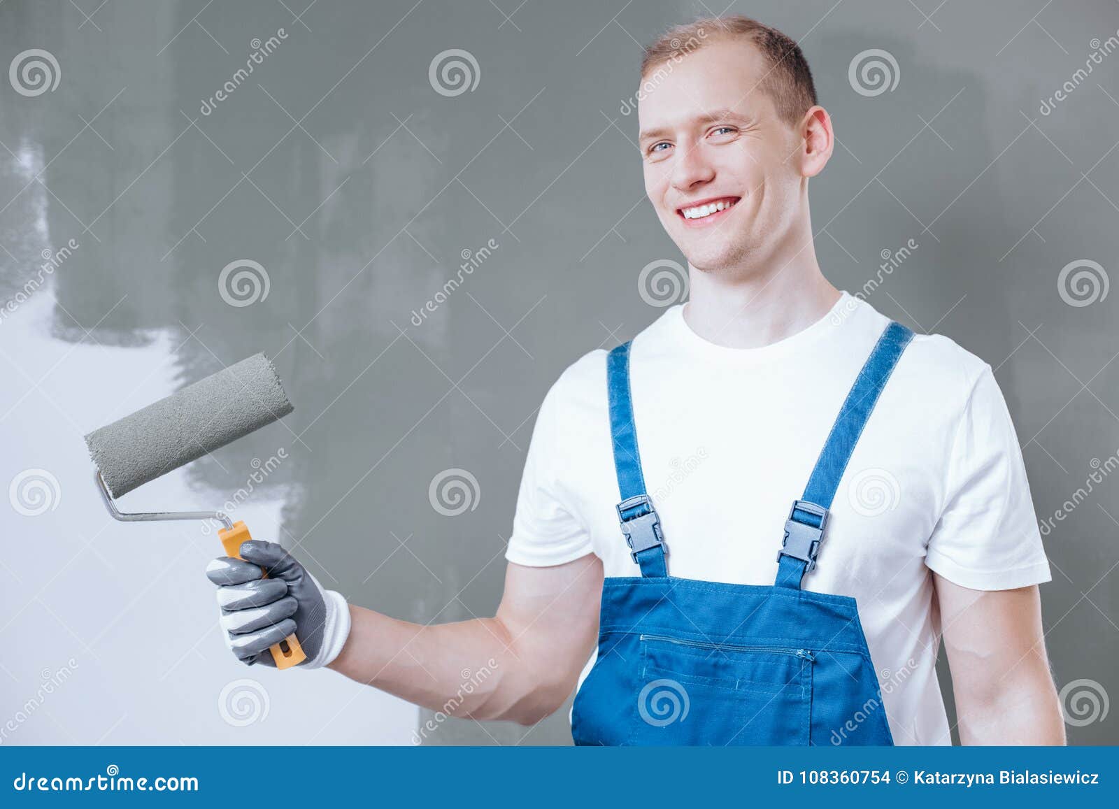 Smiling Painter with Paint Roller Stock Photo - Image of equipment ...