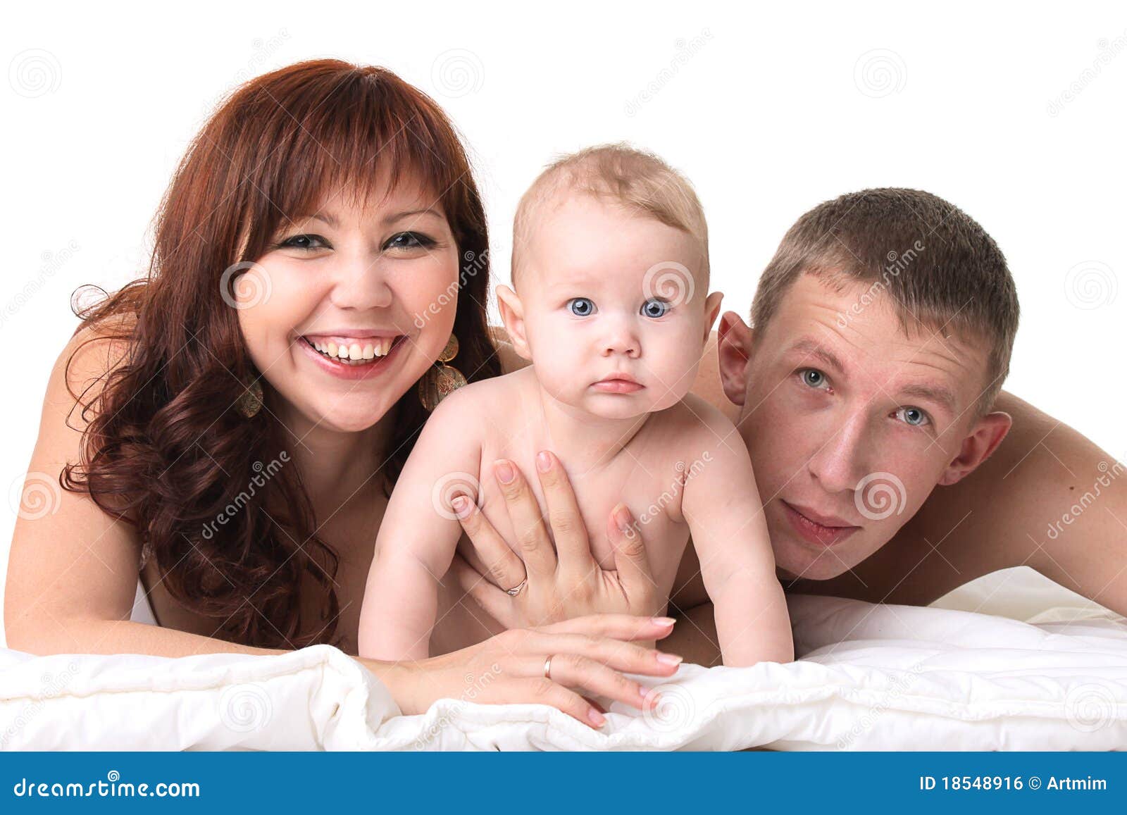 Smiling Parents and a Child Looking at Camera Stock Photo - Image of ...