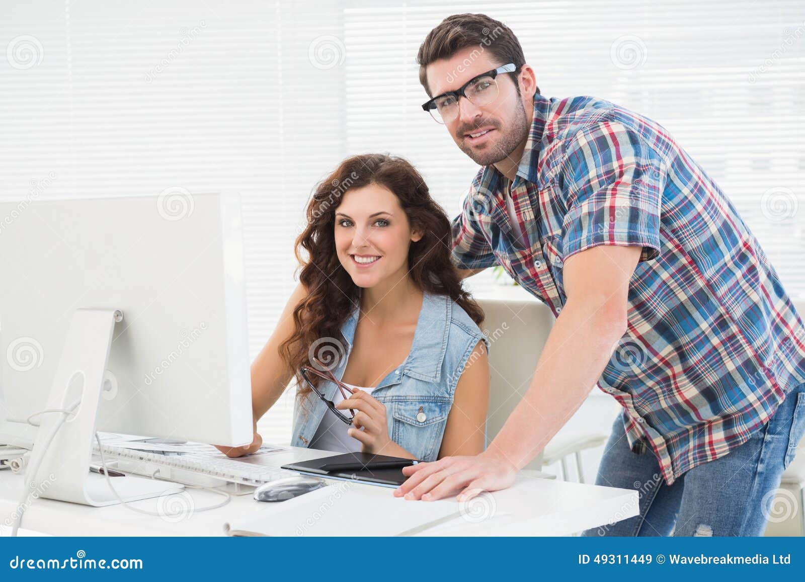 Smiling Partners Using Computer Together Stock Image - Image of desk ...