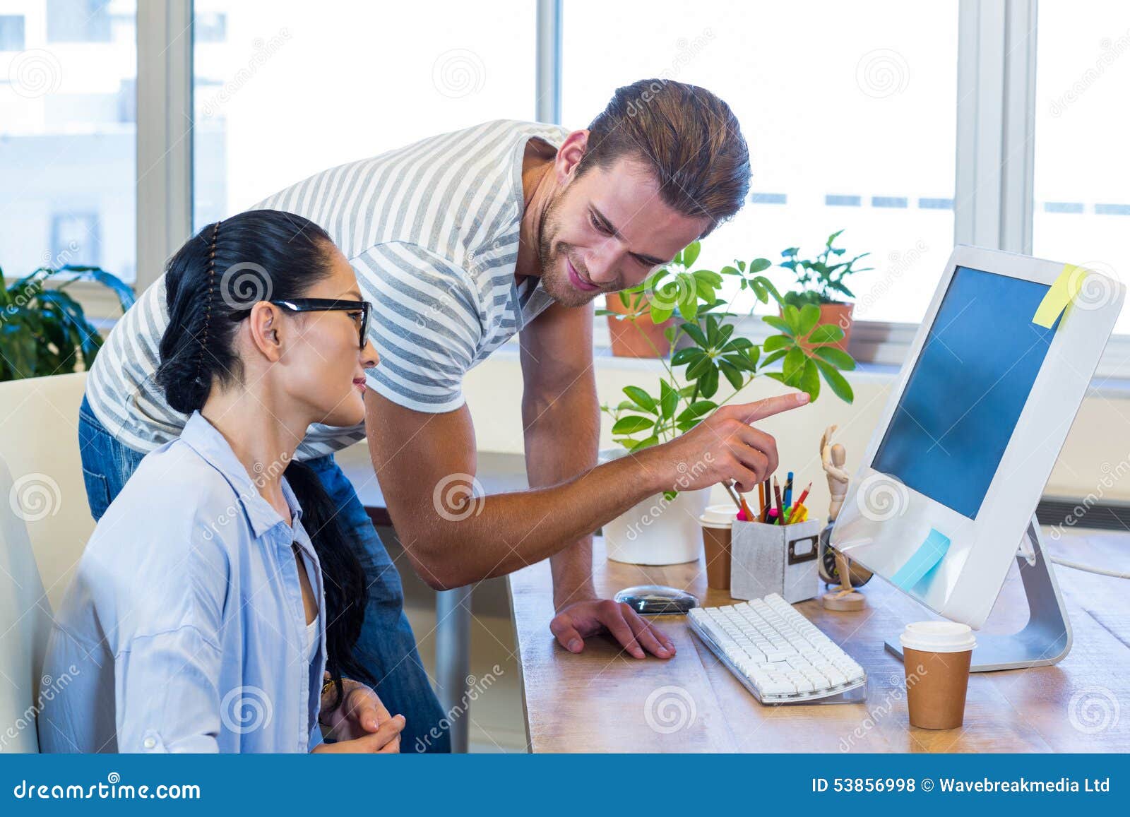 Smiling Partners Working Together on Computer Stock Photo - Image of ...