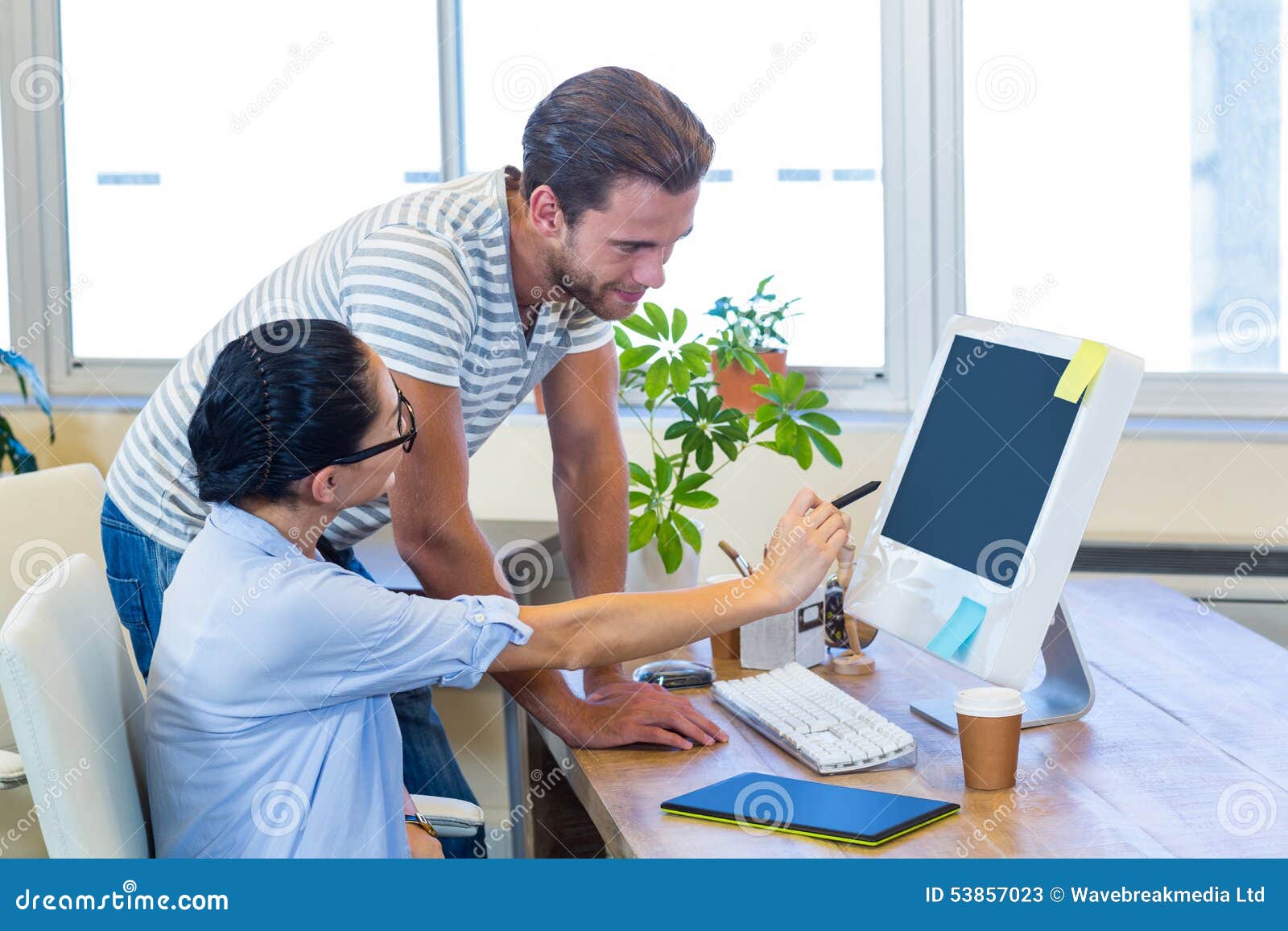 Smiling Partners Working Together on Computer Stock Image - Image of ...