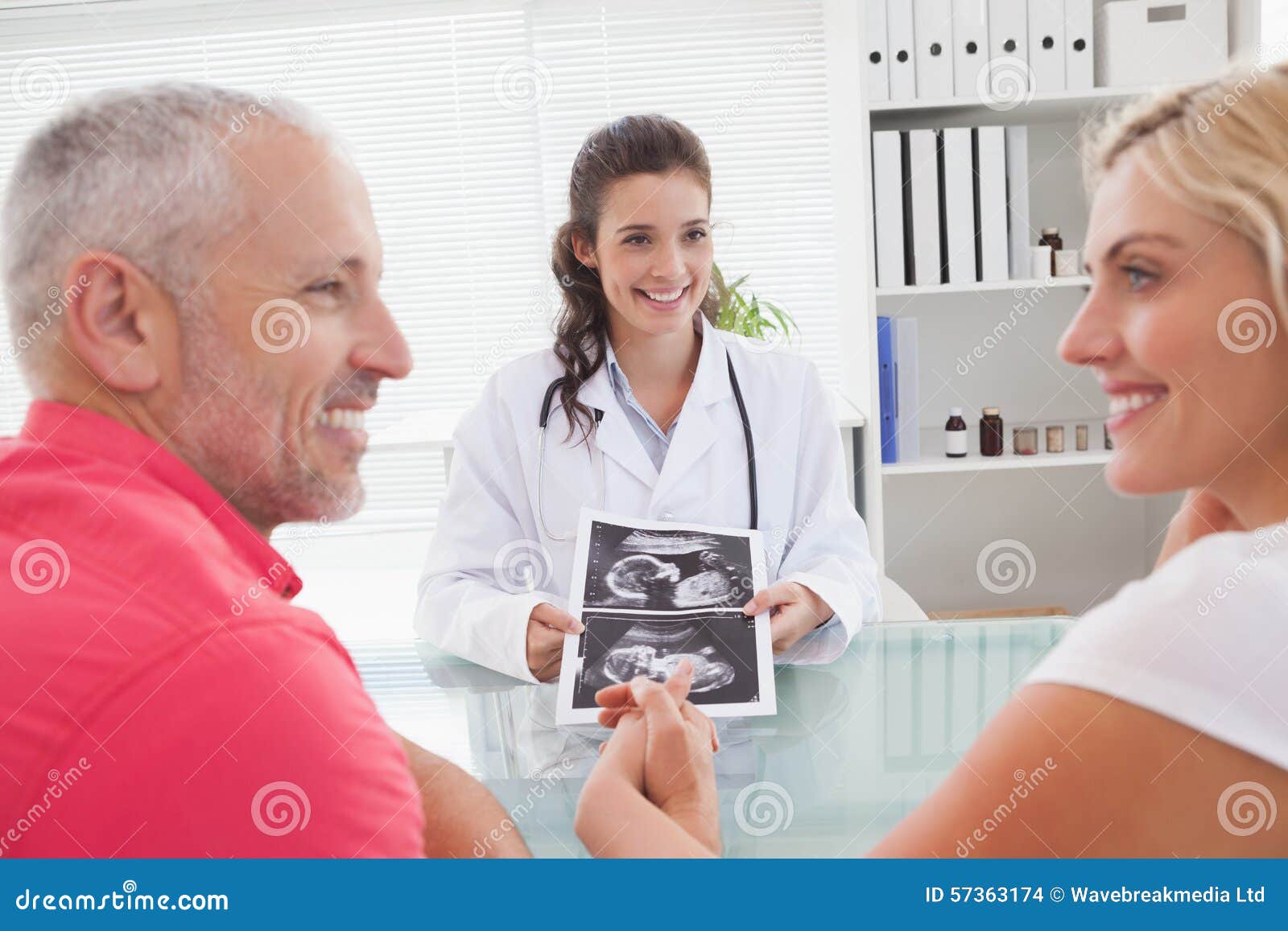 Smiling Patient Consulting a Doctor Stock Photo - Image of female ...
