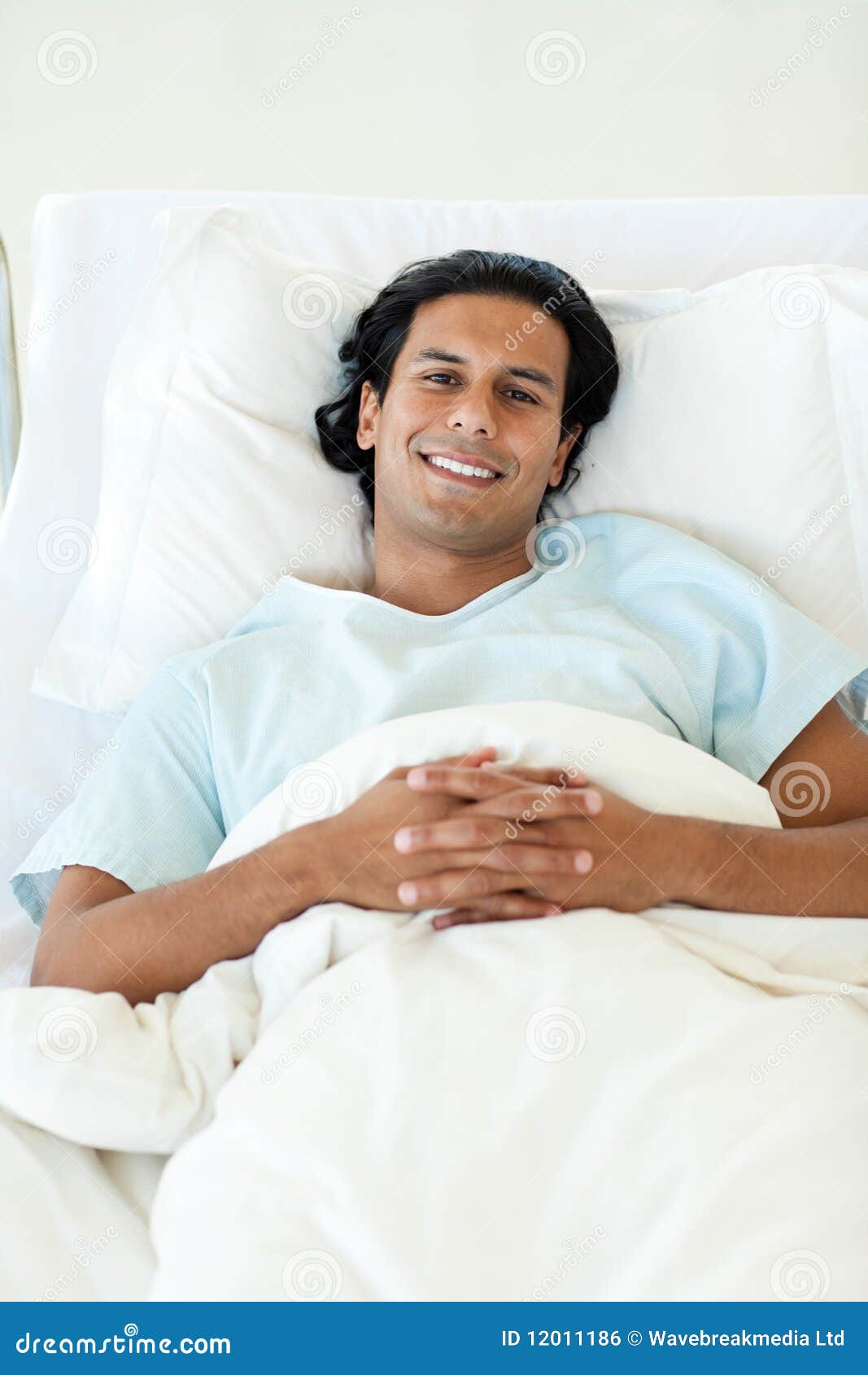 Smiling Patient Lying on a Hospital Bed Stock Photo - Image of vertical ...