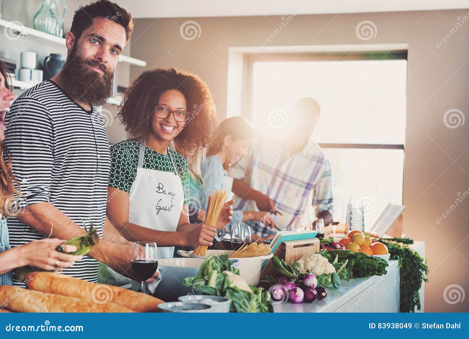 Smiling People Looking at Camera while Cooking Stock Image - Image of ...