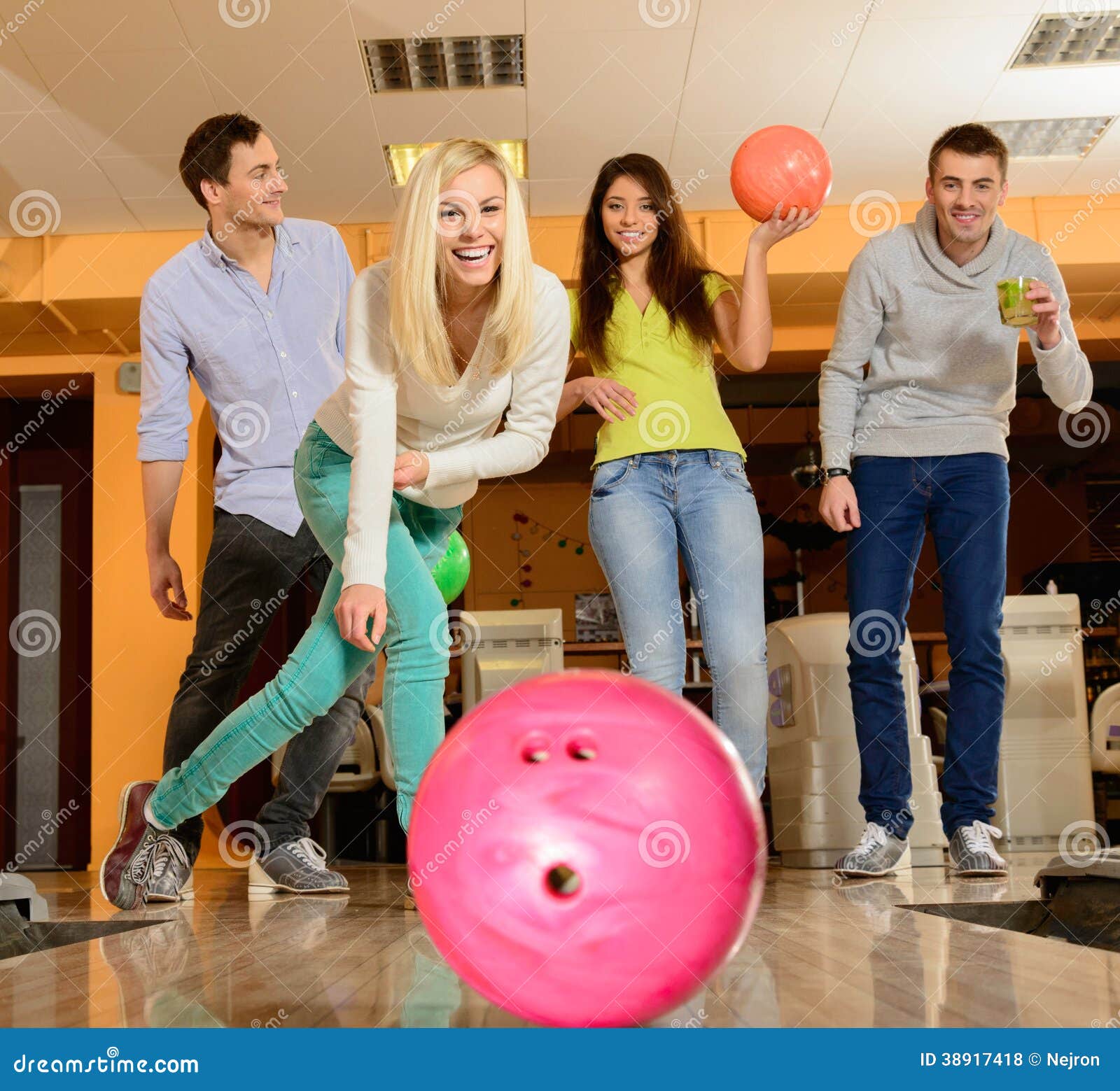 Smiling People Playing Bowling Stock Photo - Image of people, bowling ...