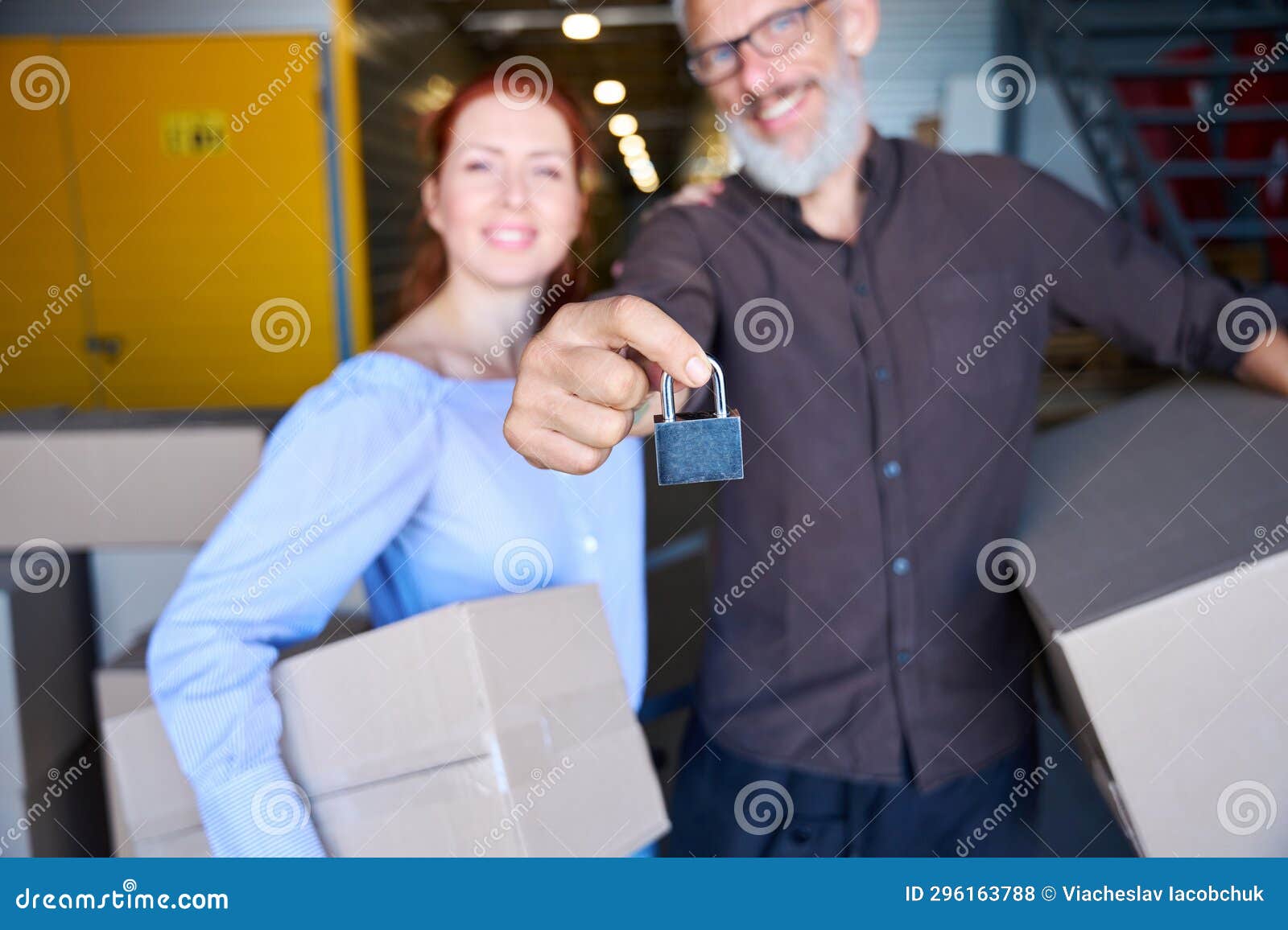 Smiling People Stand with Boxes of Things in a Warehouse Stock Photo ...