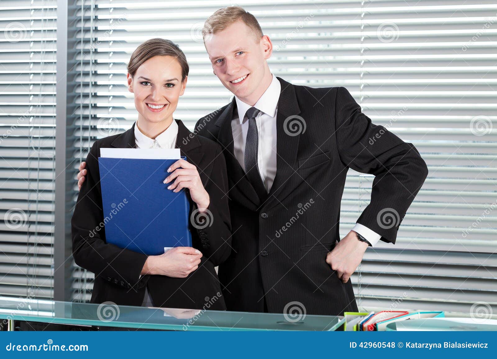 Smiling People Standing Behind Reception Desk Stock Photo - Image of ...