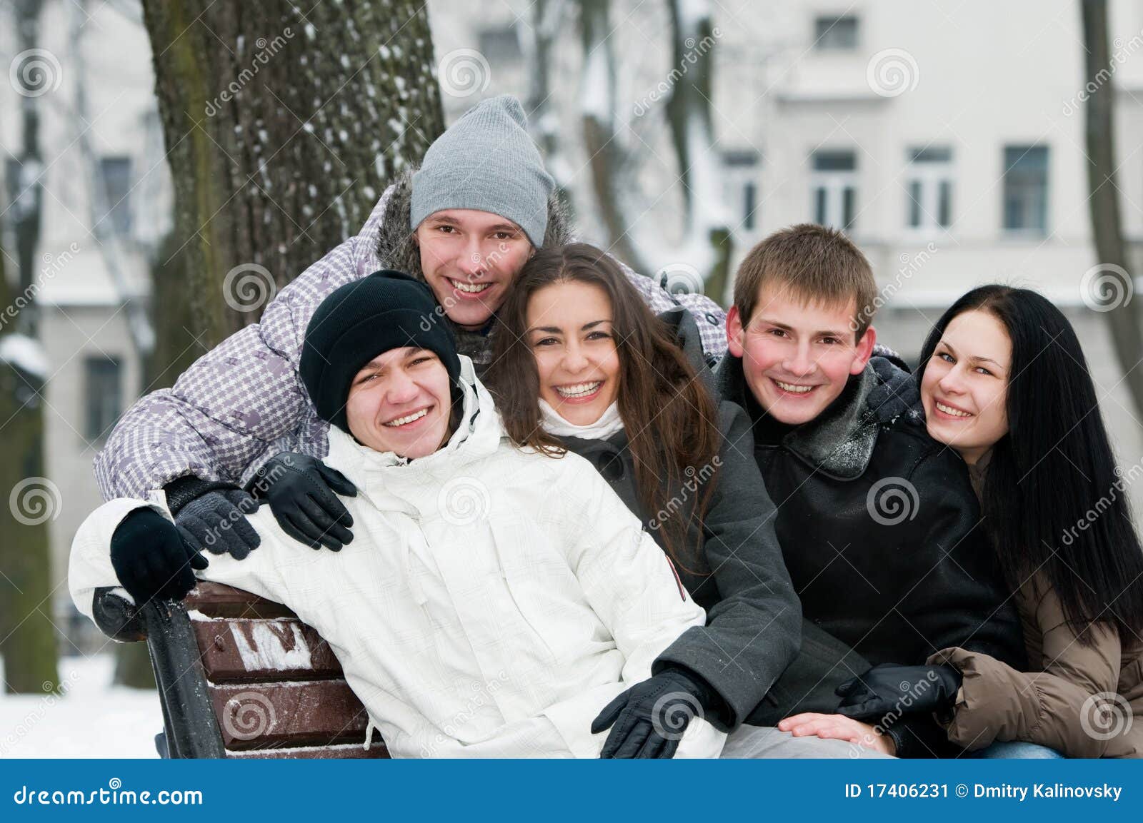 Smiling People in Warm Clothing at Stock Image - Image of bench ...