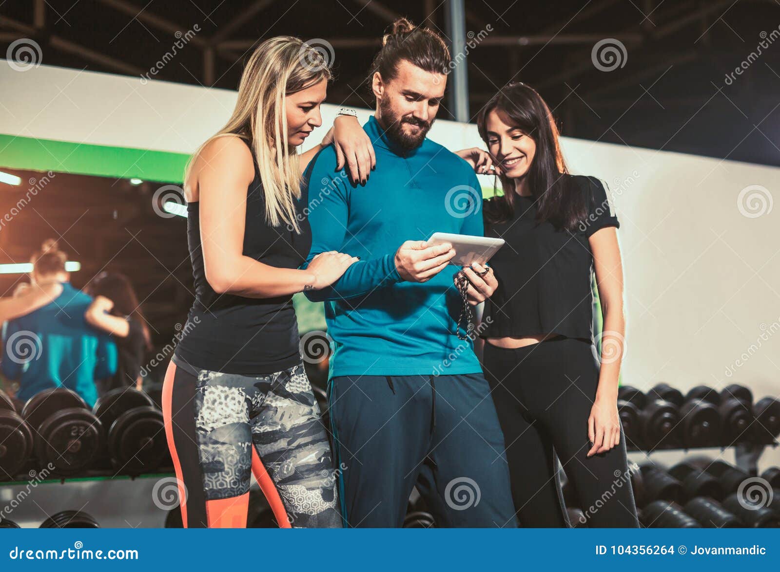 Smiling Personal Trainer Using Digital Tablet Stock Photo - Image of ...