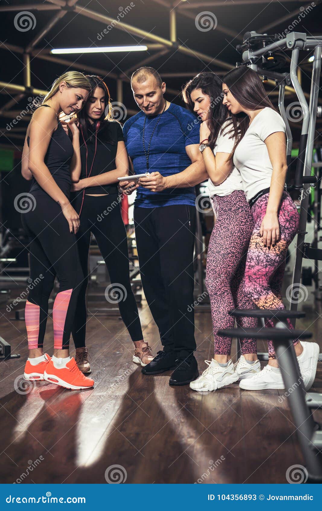 Smiling Personal Trainer Using Digital Tablet Stock Image - Image of ...