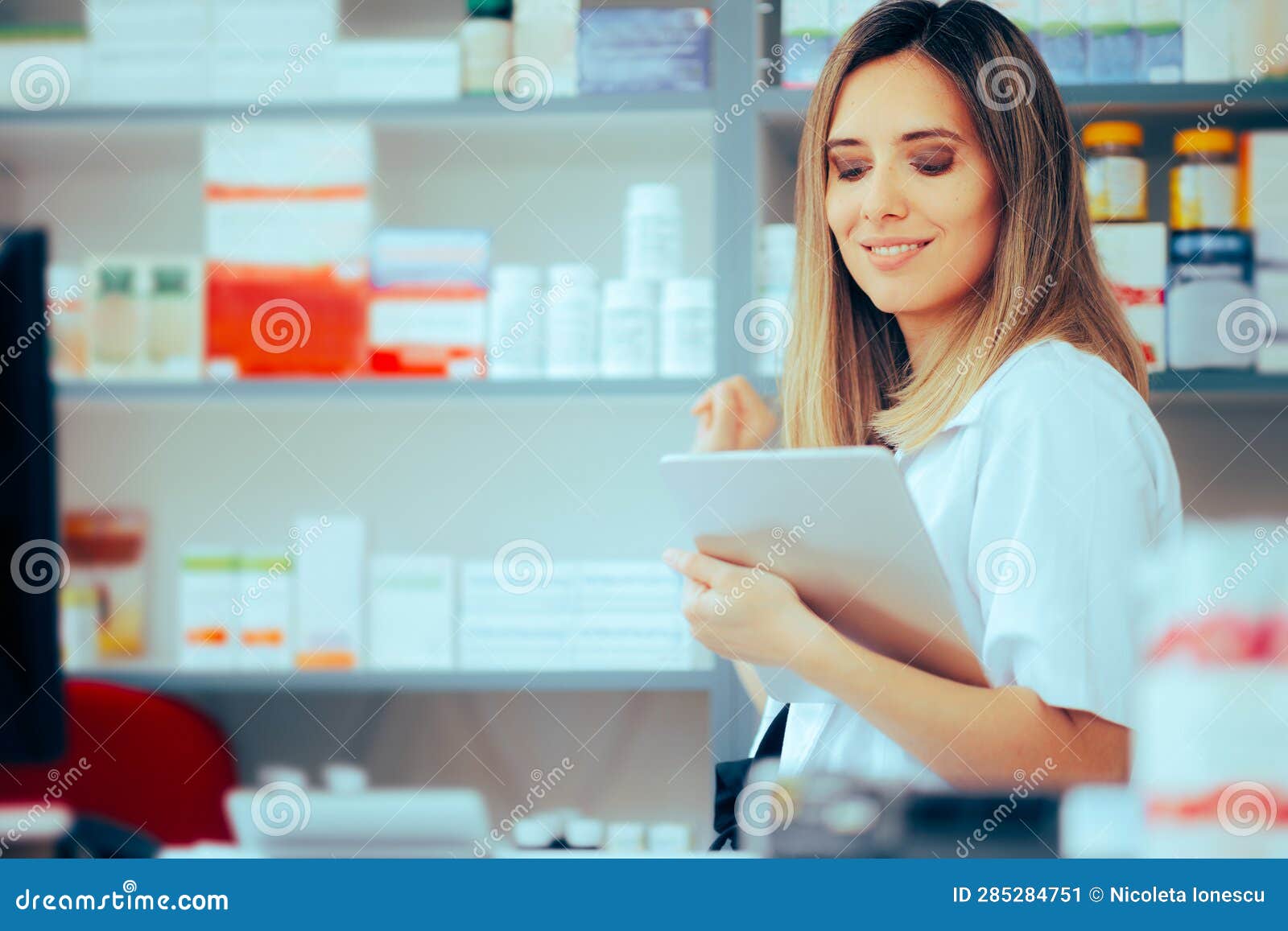 Smiling Pharmacist Holding a Pc Tablet Working on Inventory Task Stock ...