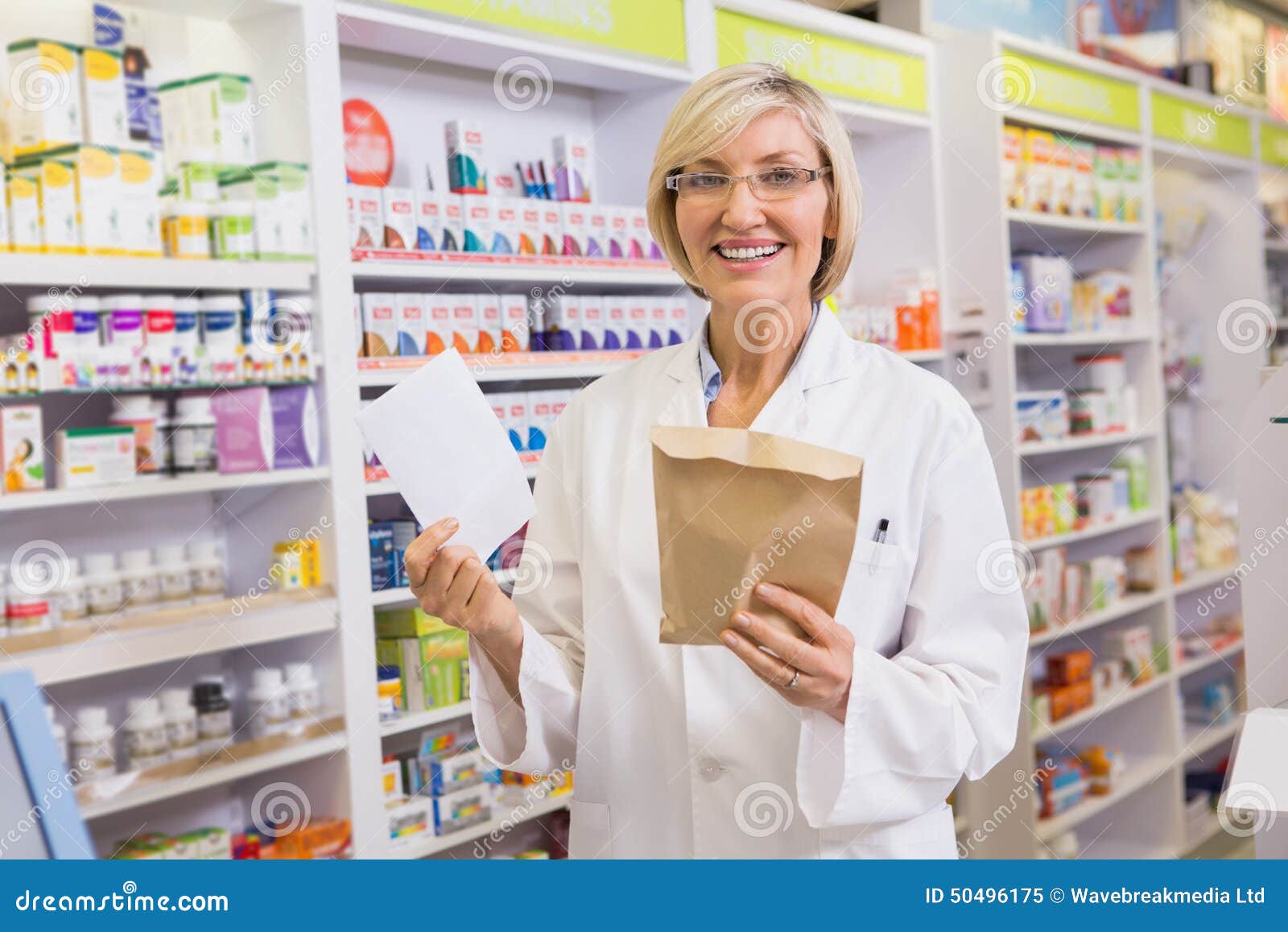Smiling Pharmacist Holding Prescription and Envelope Stock Image ...