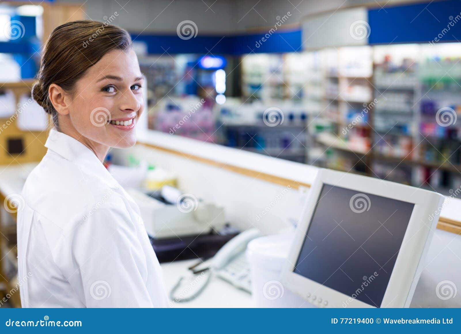 Smiling Pharmacist Standing at Counter in Pharmacy Stock Photo - Image ...