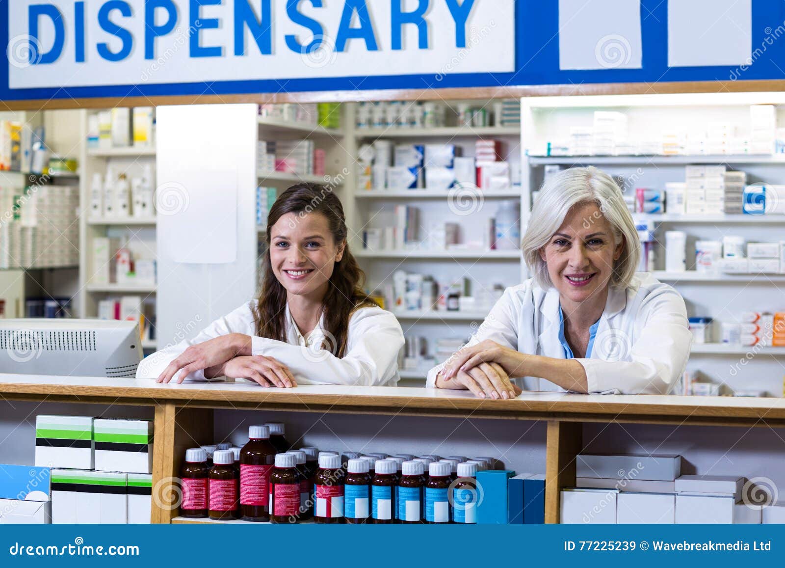 Smiling Pharmacists Standing at Counter in Pharmacy Stock Image - Image ...