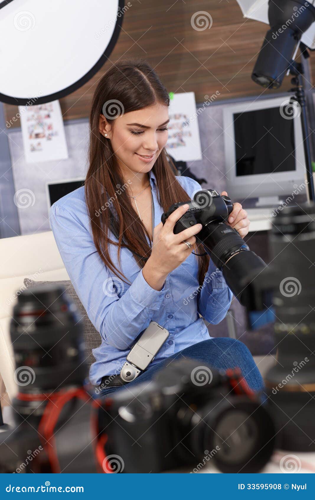 Smiling Photographer Checking Camera Stock Photo - Image of happiness ...