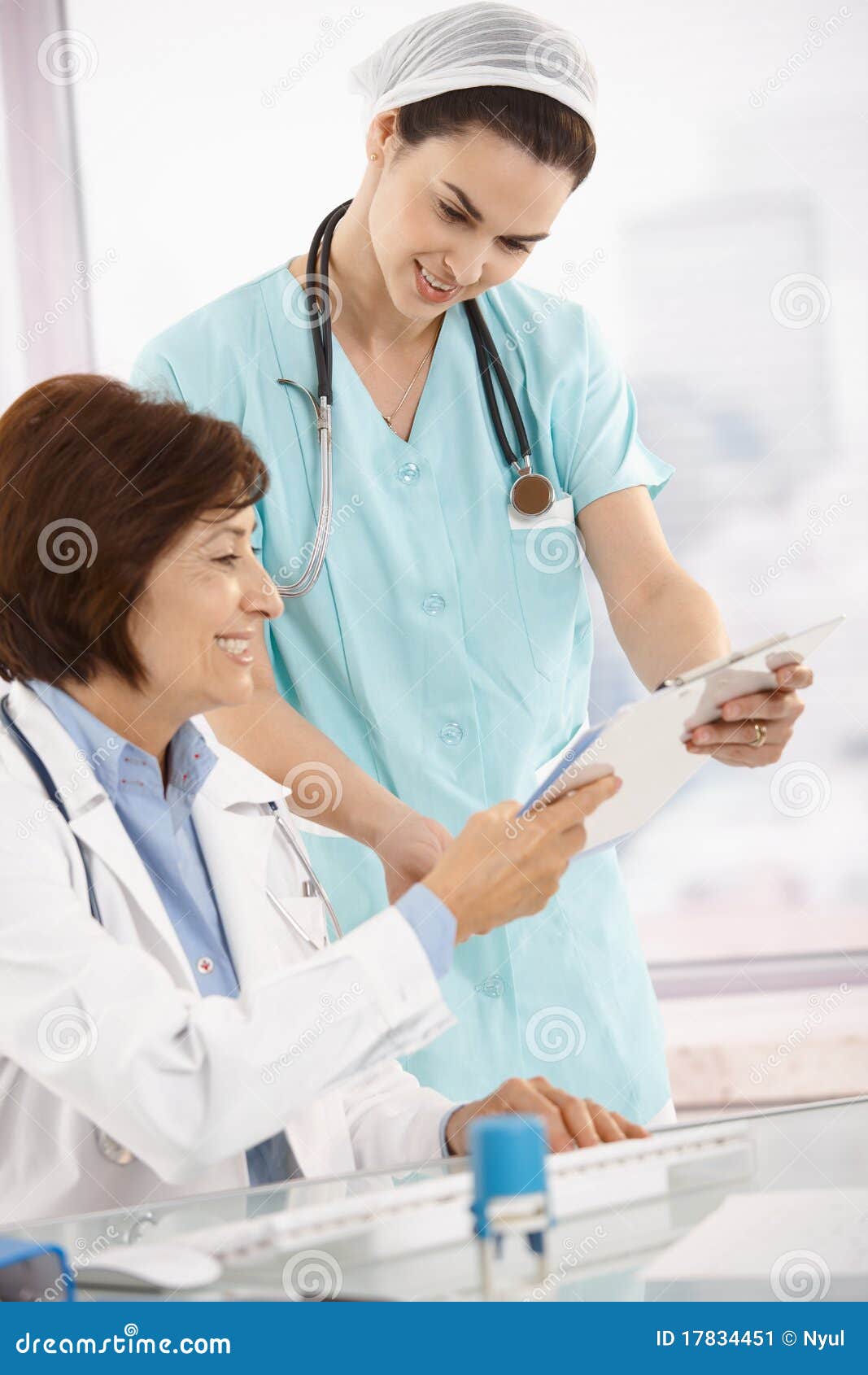 Smiling Physician Working with Nurse Stock Image - Image of cooperation ...
