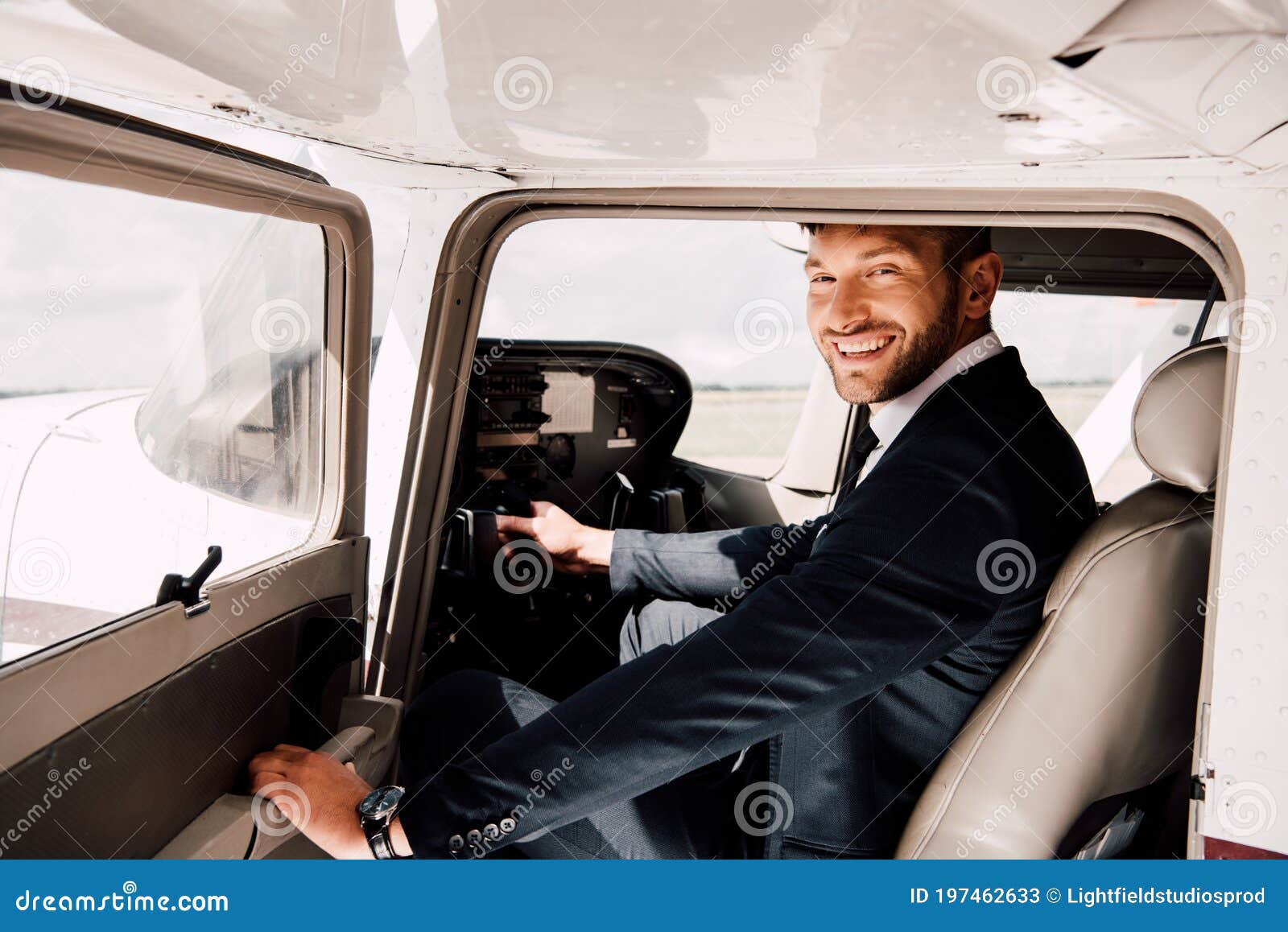 Pilot in Formal Wear Sitting in Plane and Holding Stock Image - Image ...