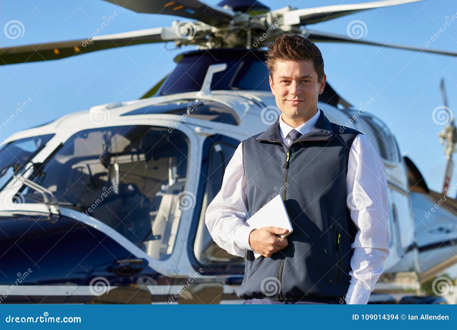 Portrait of Pilot Standing in Front of Helicopter with Digital T Stock ...