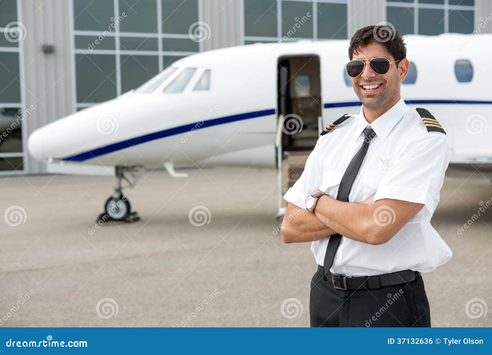 Smiling Pilot Standing in Front of Private Jet Stock Photo - Image of ...