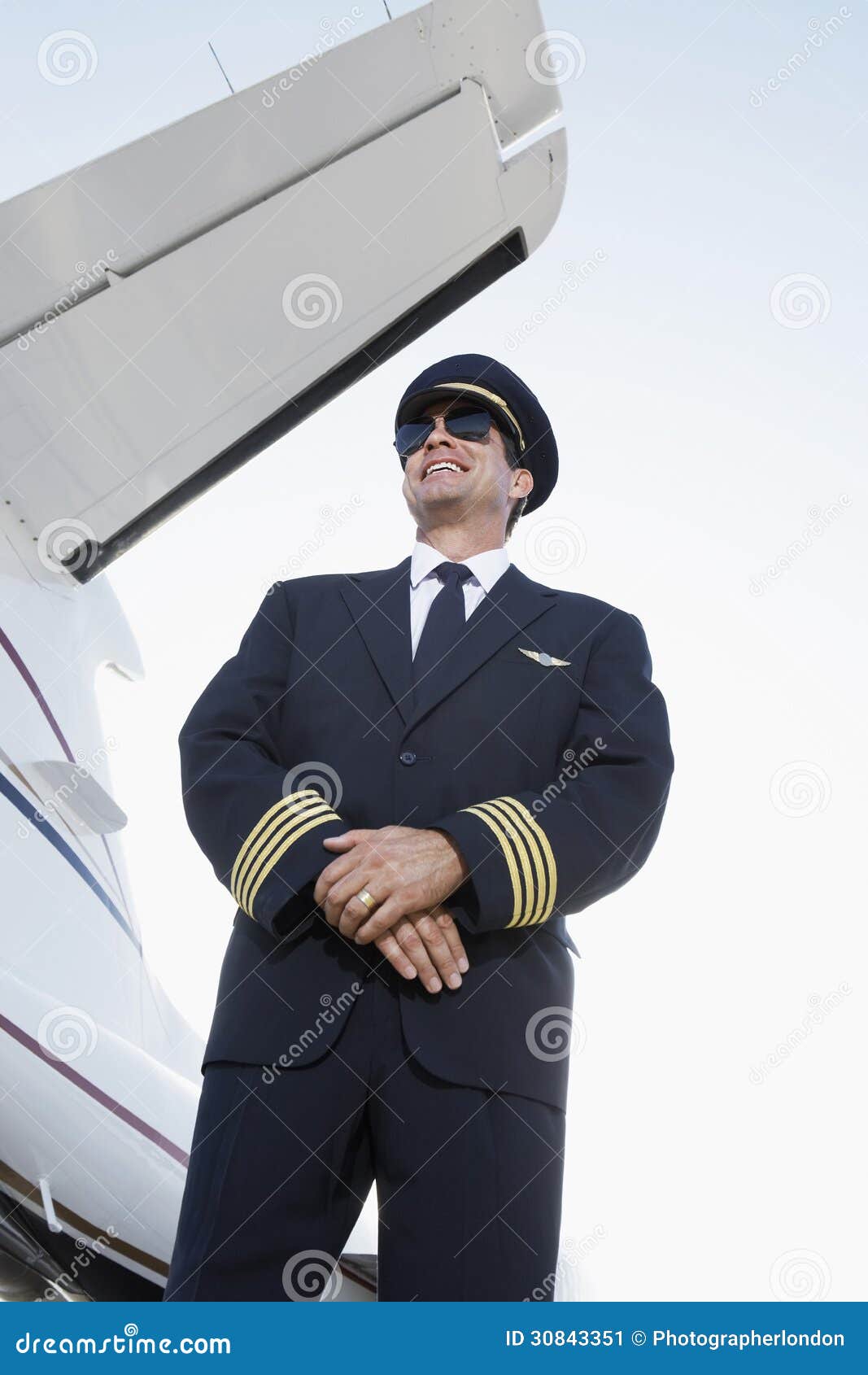 Smiling Pilot in Uniform beside an Airplane Stock Image - Image of ...