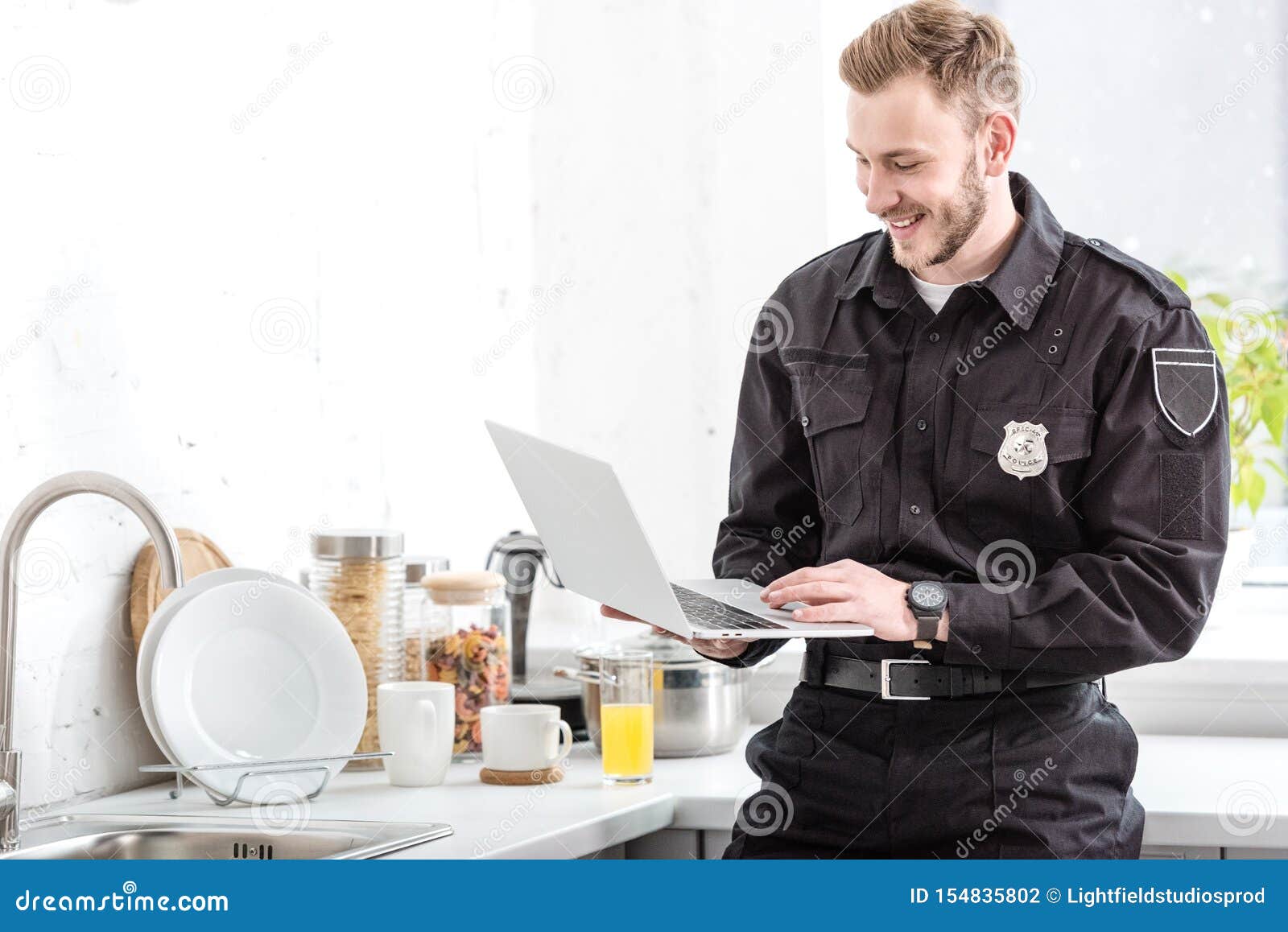 Smiling Police Officer Standing and Using Laptop Stock Photo - Image of ...