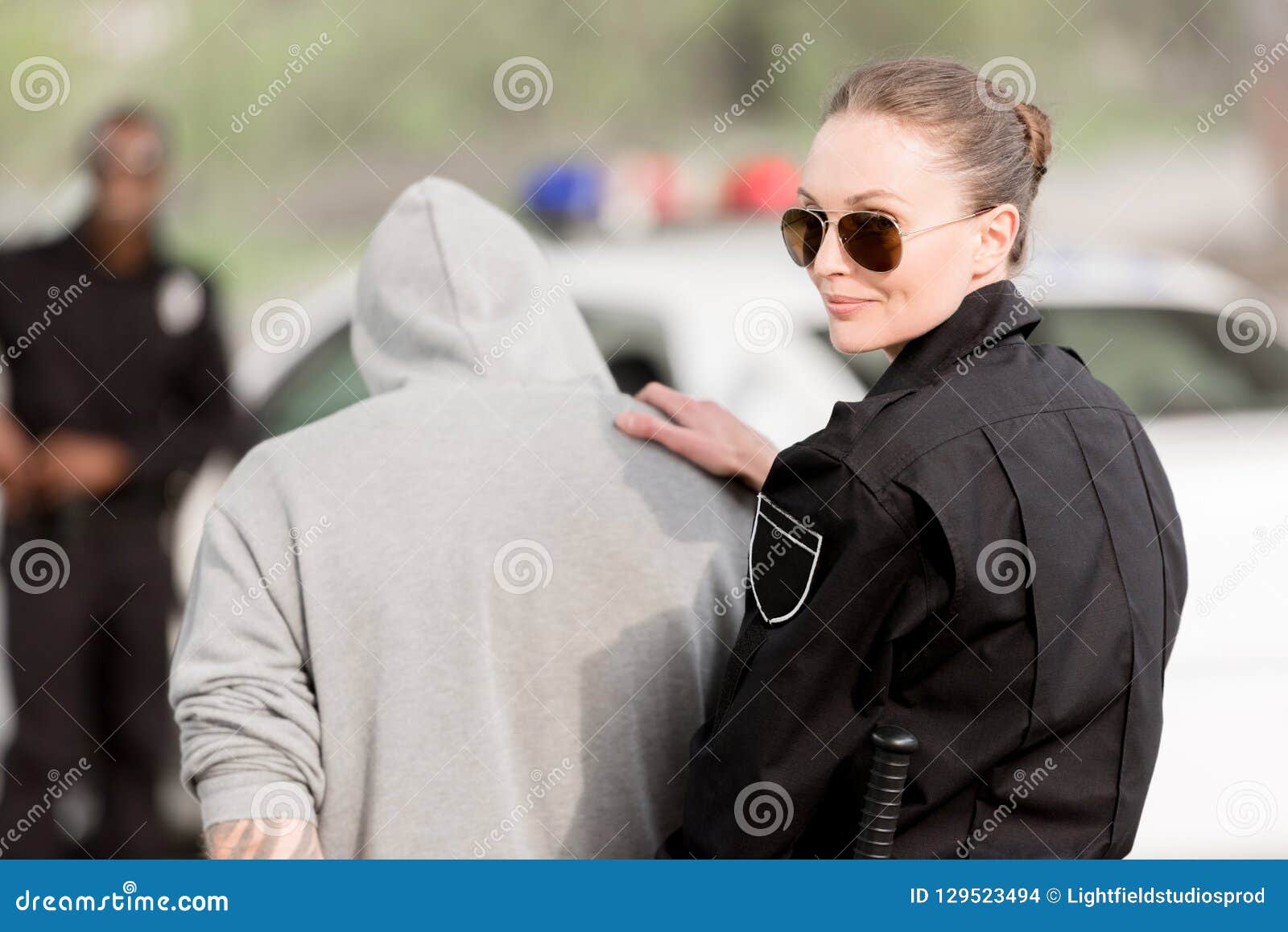 Smiling Policewoman in Sunglasses with Arrested Stock Photo - Image of ...