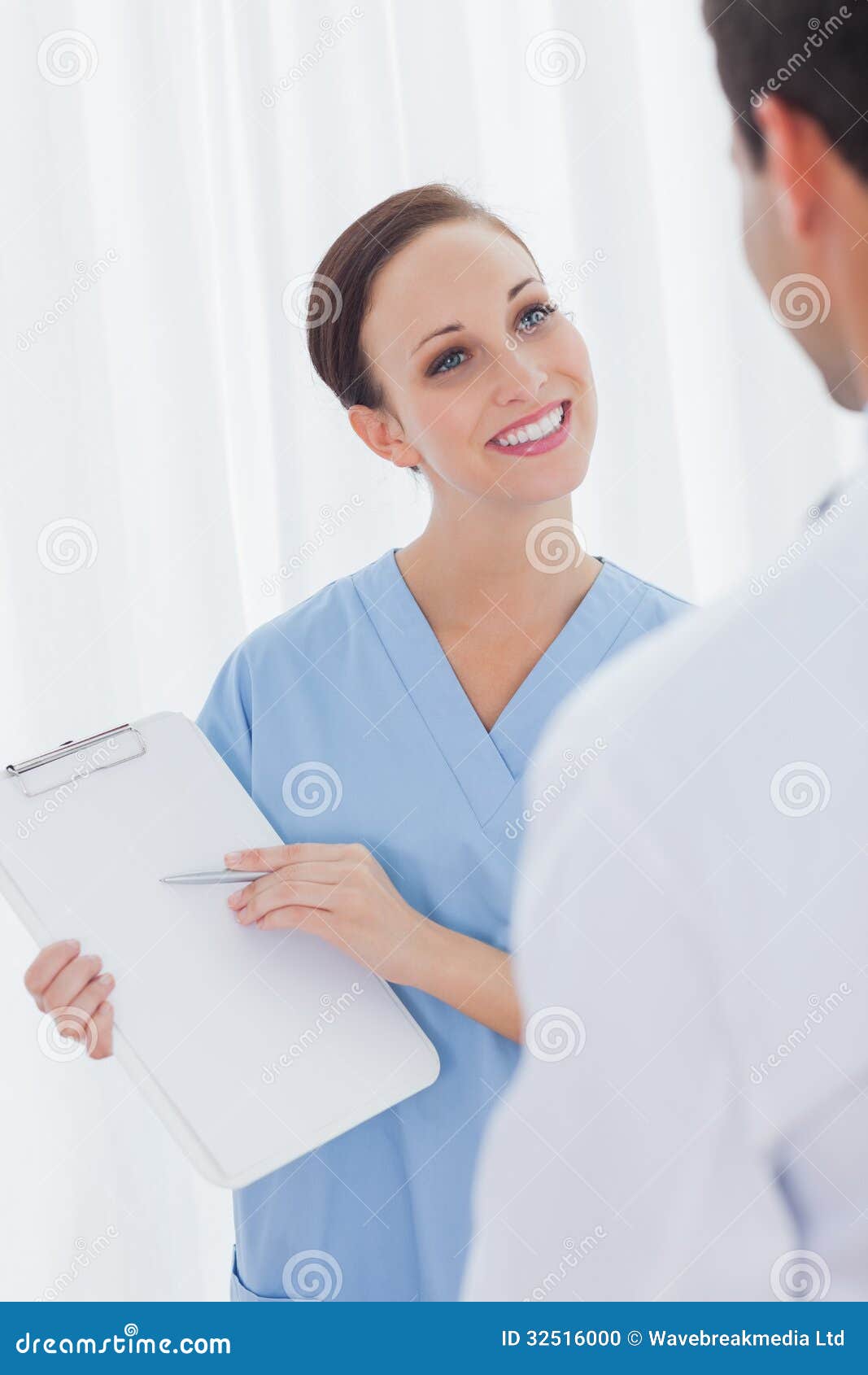Smiling Pretty Surgeon Talking with Doctor Stock Photo - Image of ...