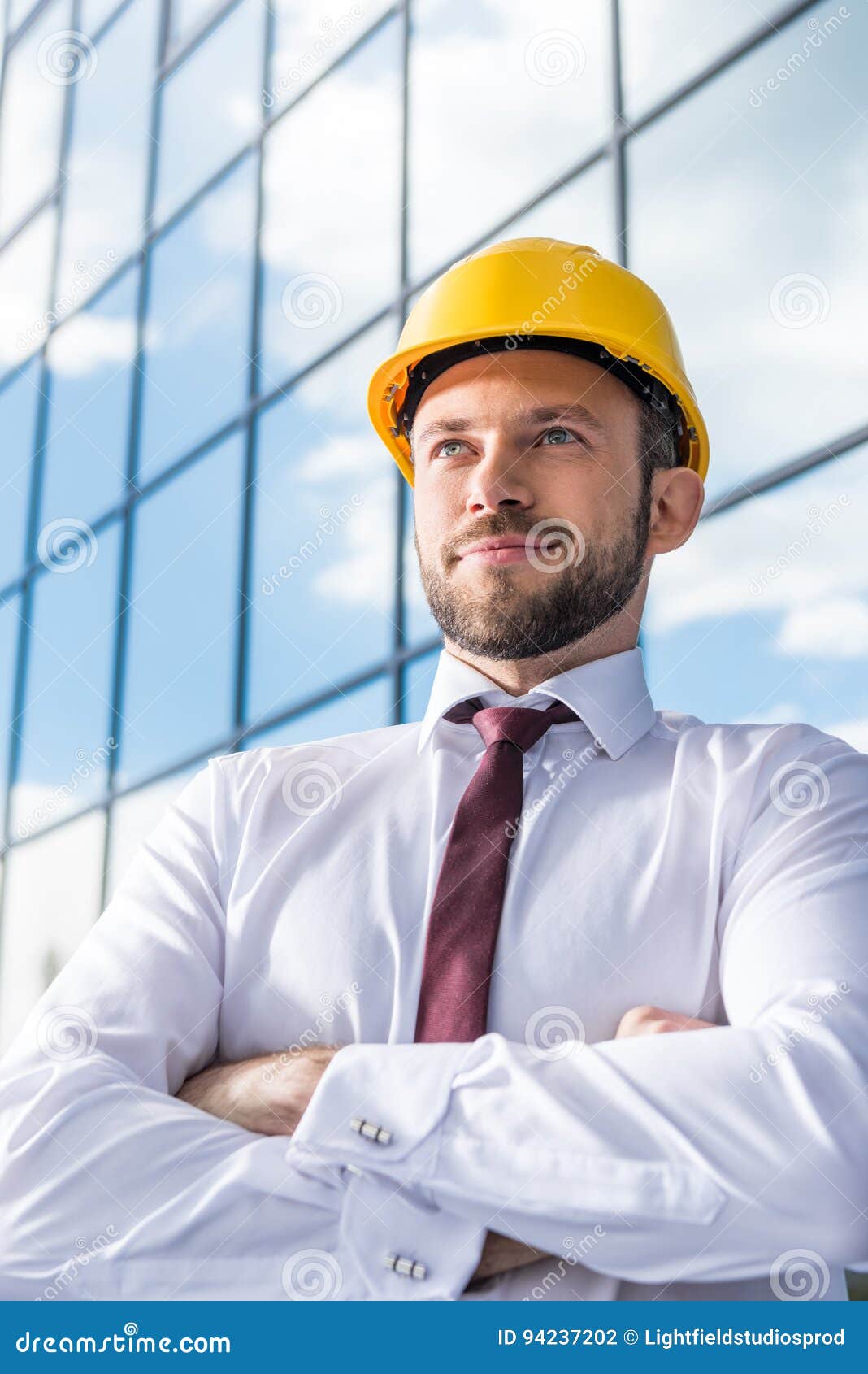 Smiling Professional Architect in Hard Hat Against Building Stock Photo ...