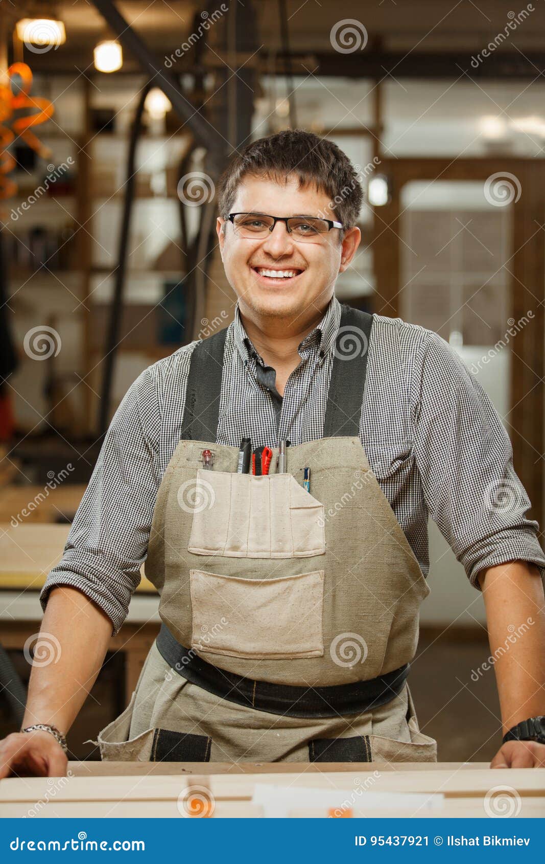 Smiling Professional Carpenter in Gasses and Uniform at Workshop Stock ...
