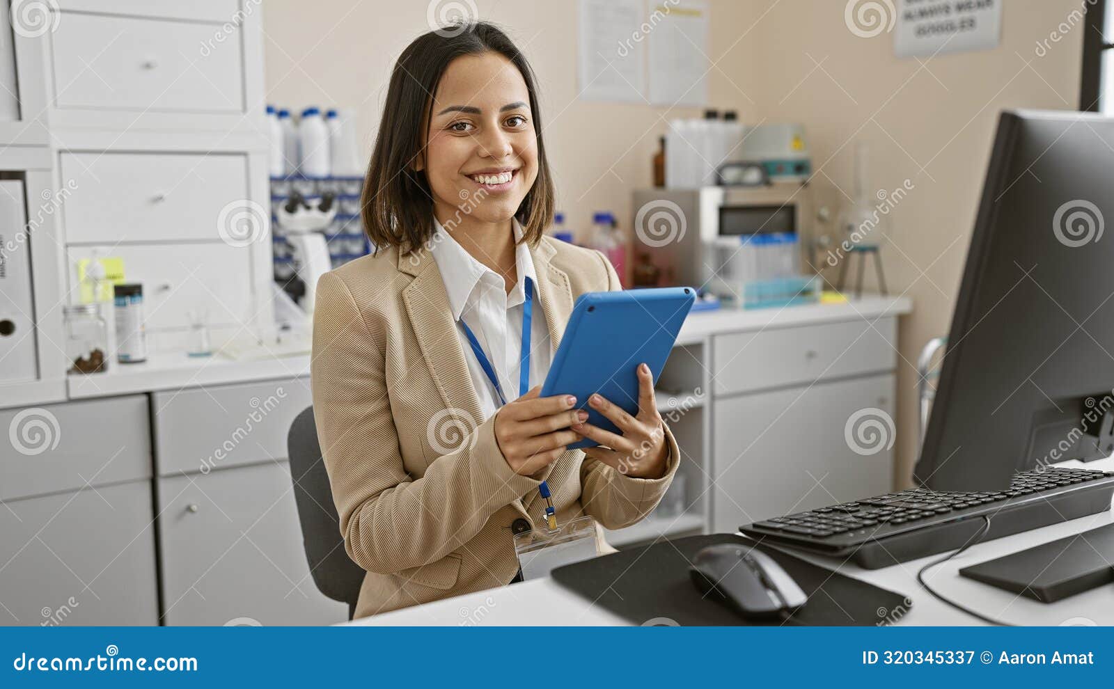 Smiling, Professional Hispanic Woman with a Tablet in a Modern Office ...