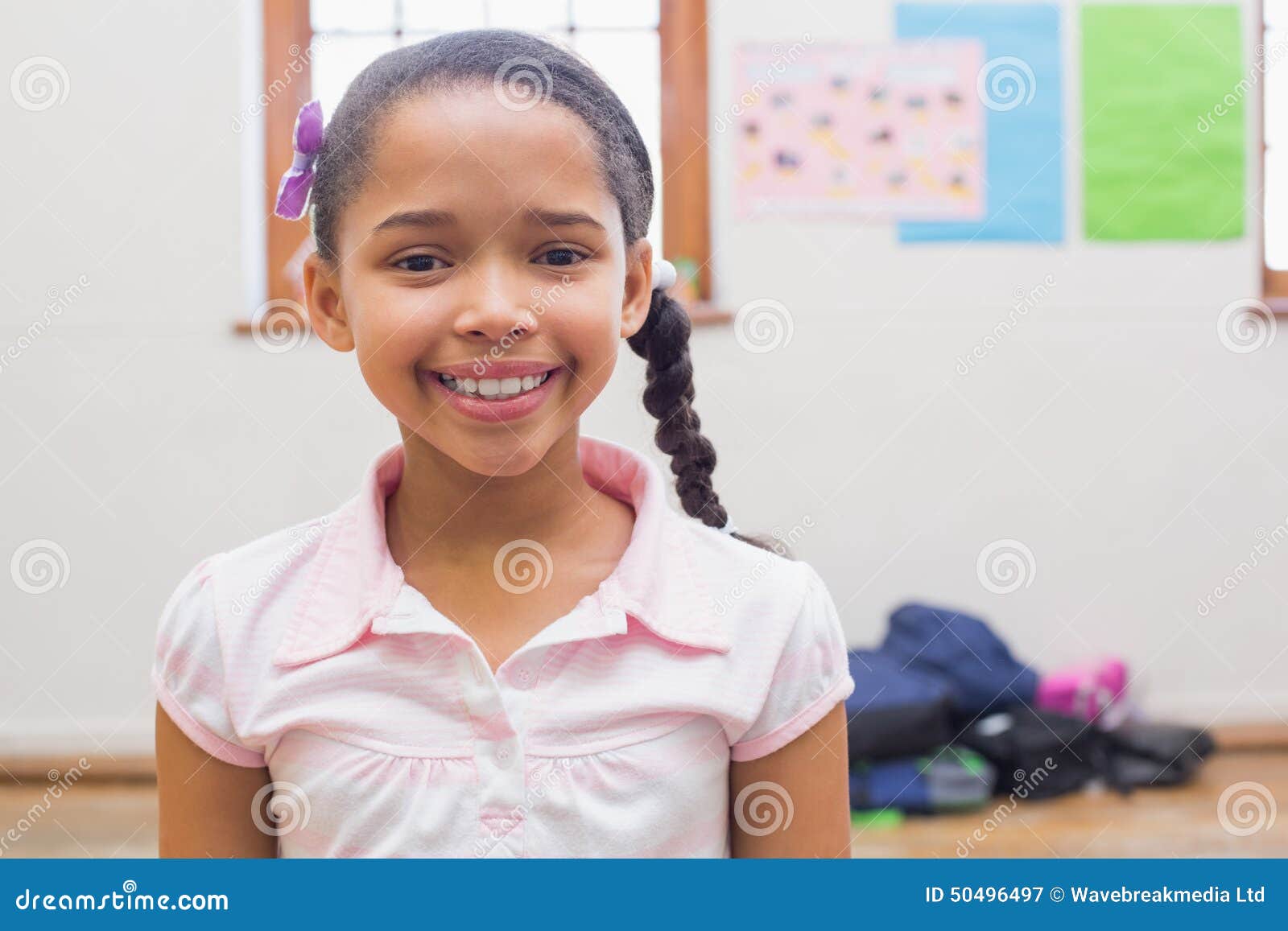 Smiling pupil in classroom stock image. Image of person - 50496497