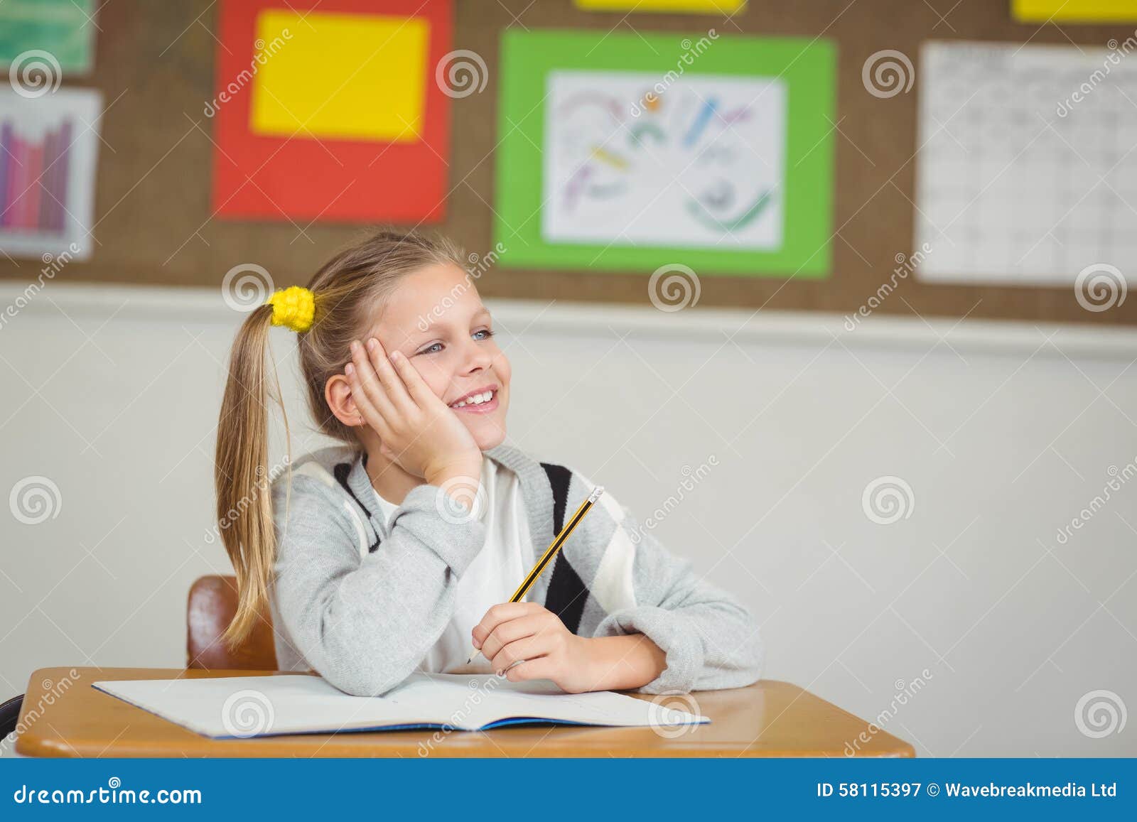 Smiling Pupil Daydreaming in a Classroom Stock Image - Image of ...