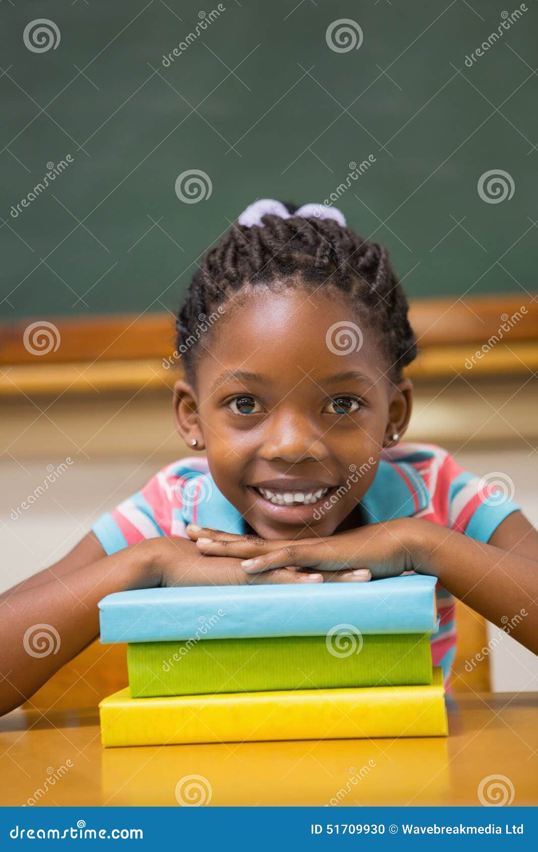Smiling Pupil Sitting at Her Desk Stock Photo - Image of desk, chair ...
