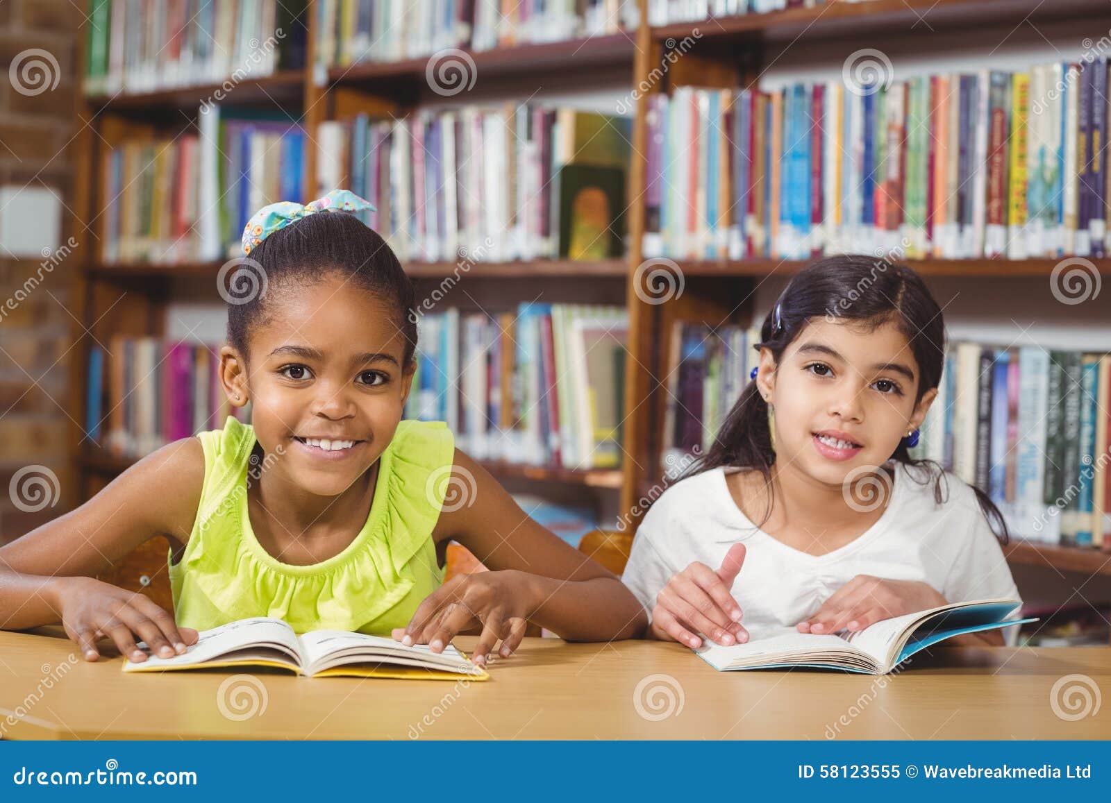 Smiling Pupils Reading Books in the Library Stock Image - Image of ...
